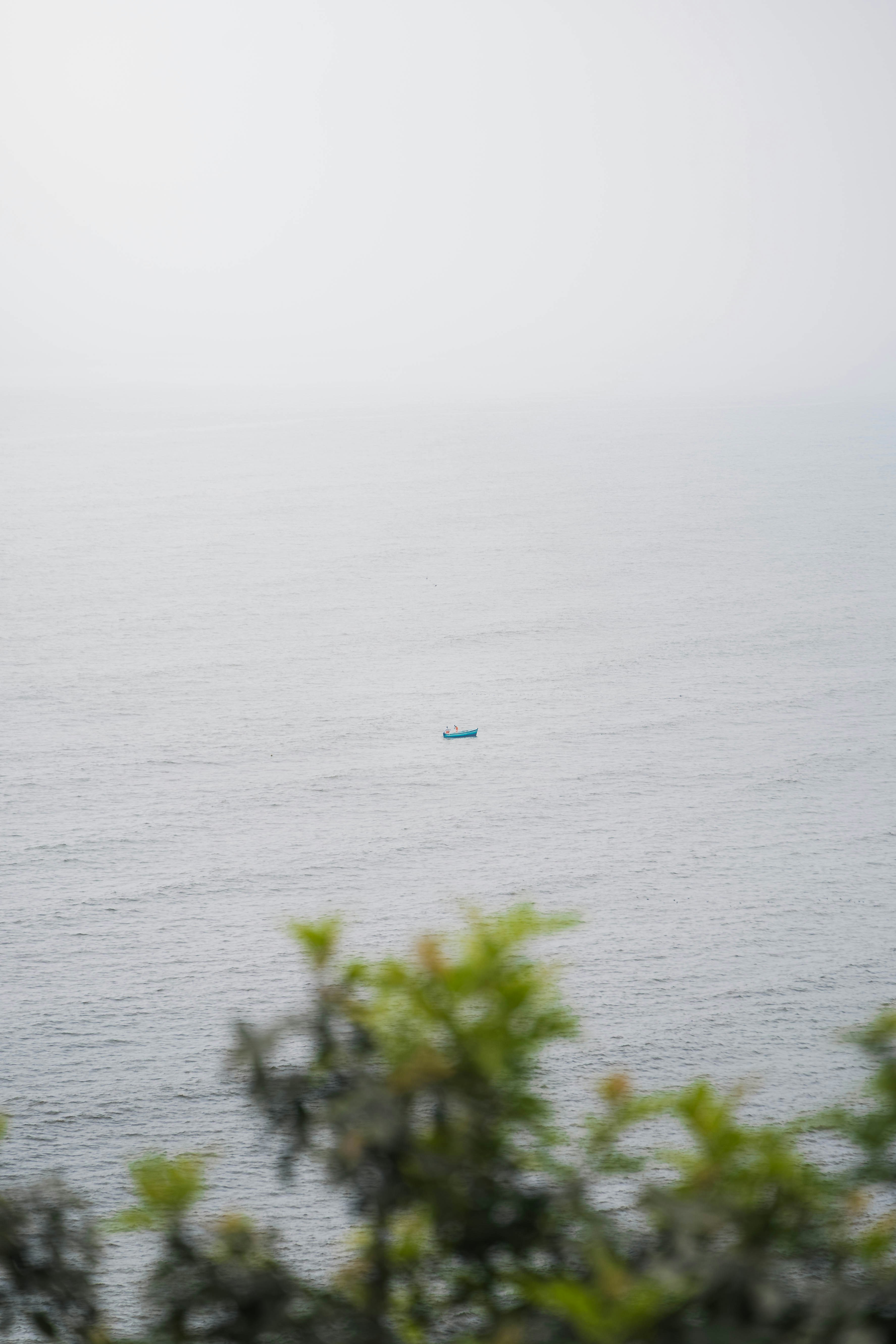 Mist over the Sea: A Distant Boat Through Veiled Quiet