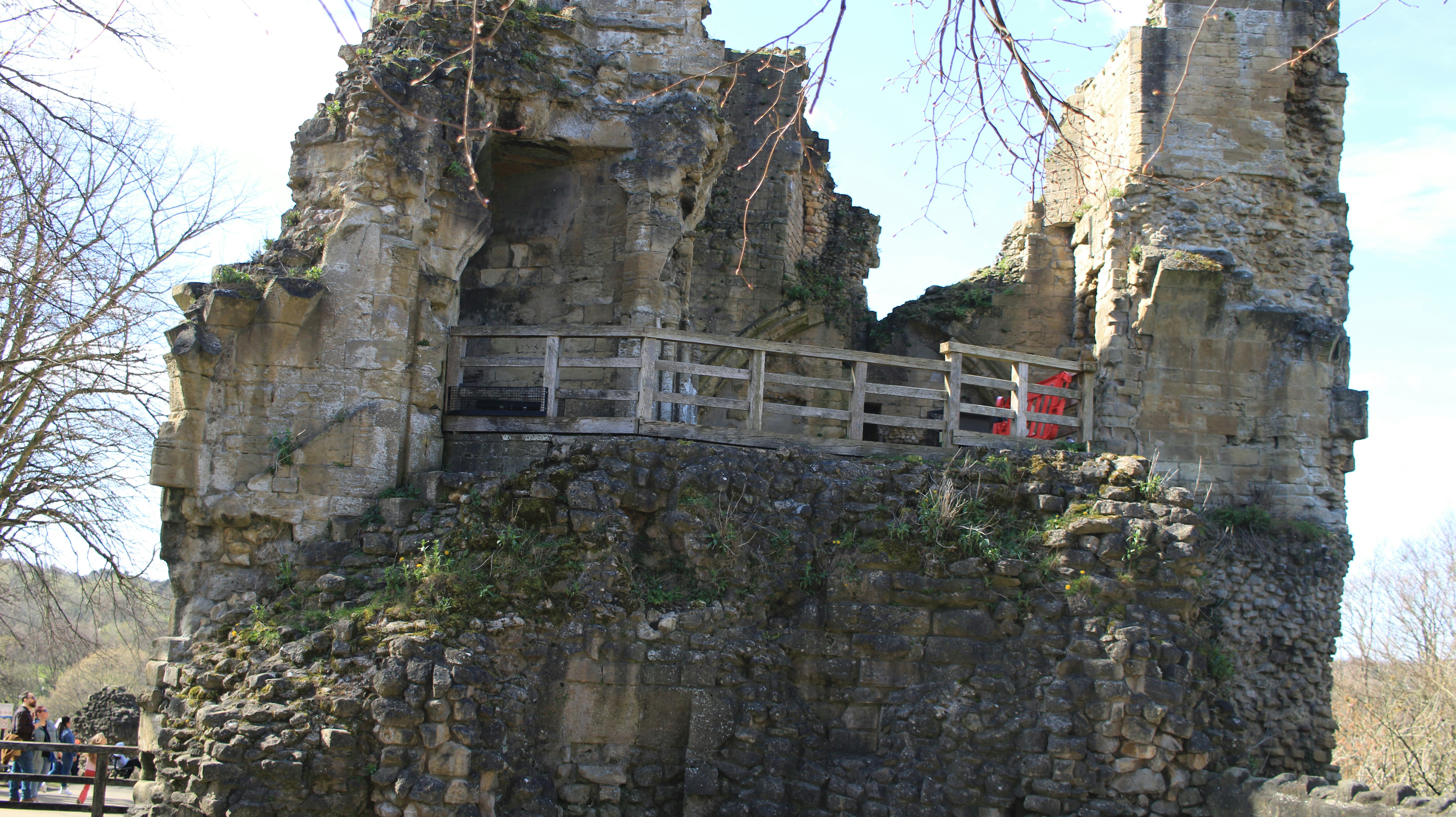 Ruinous Watch: Stones and a Timber Bridge Overgrown by Time