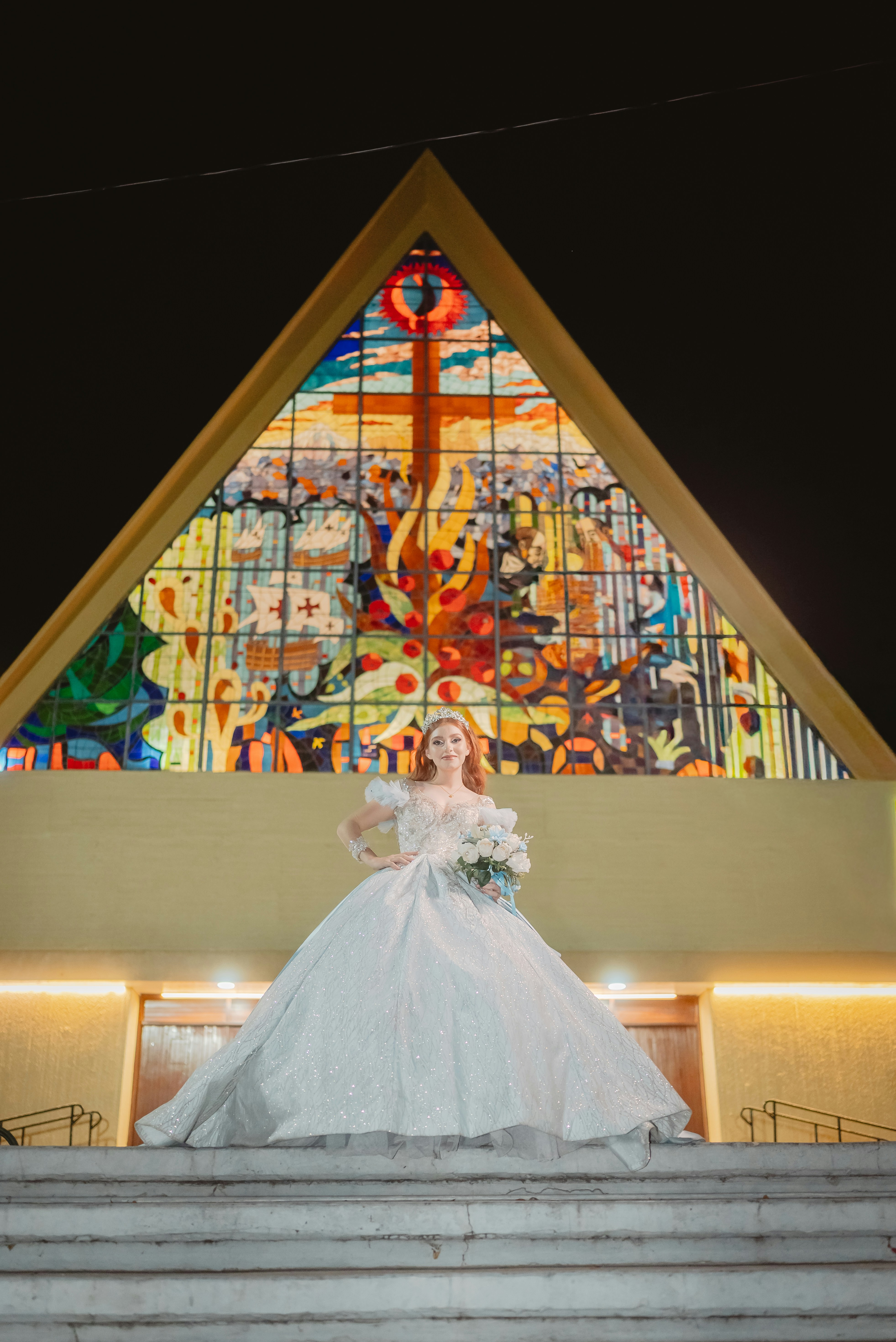 Bride in a Moonlit Cathedral: White Gown Against Colorful Stained Glass