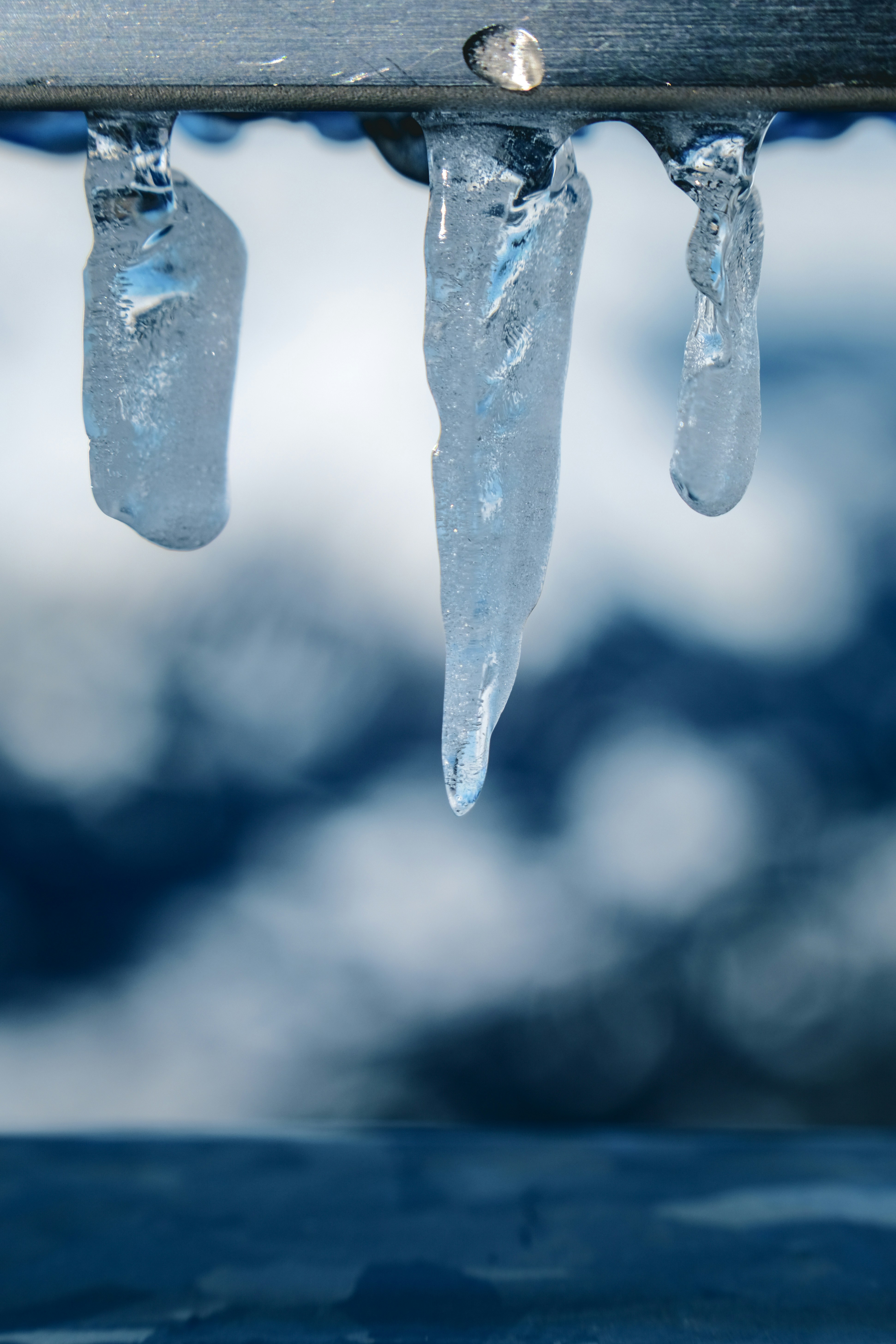 Icicles in the Air: A Close-Up of Frozen Drops Over a Frozen Rim