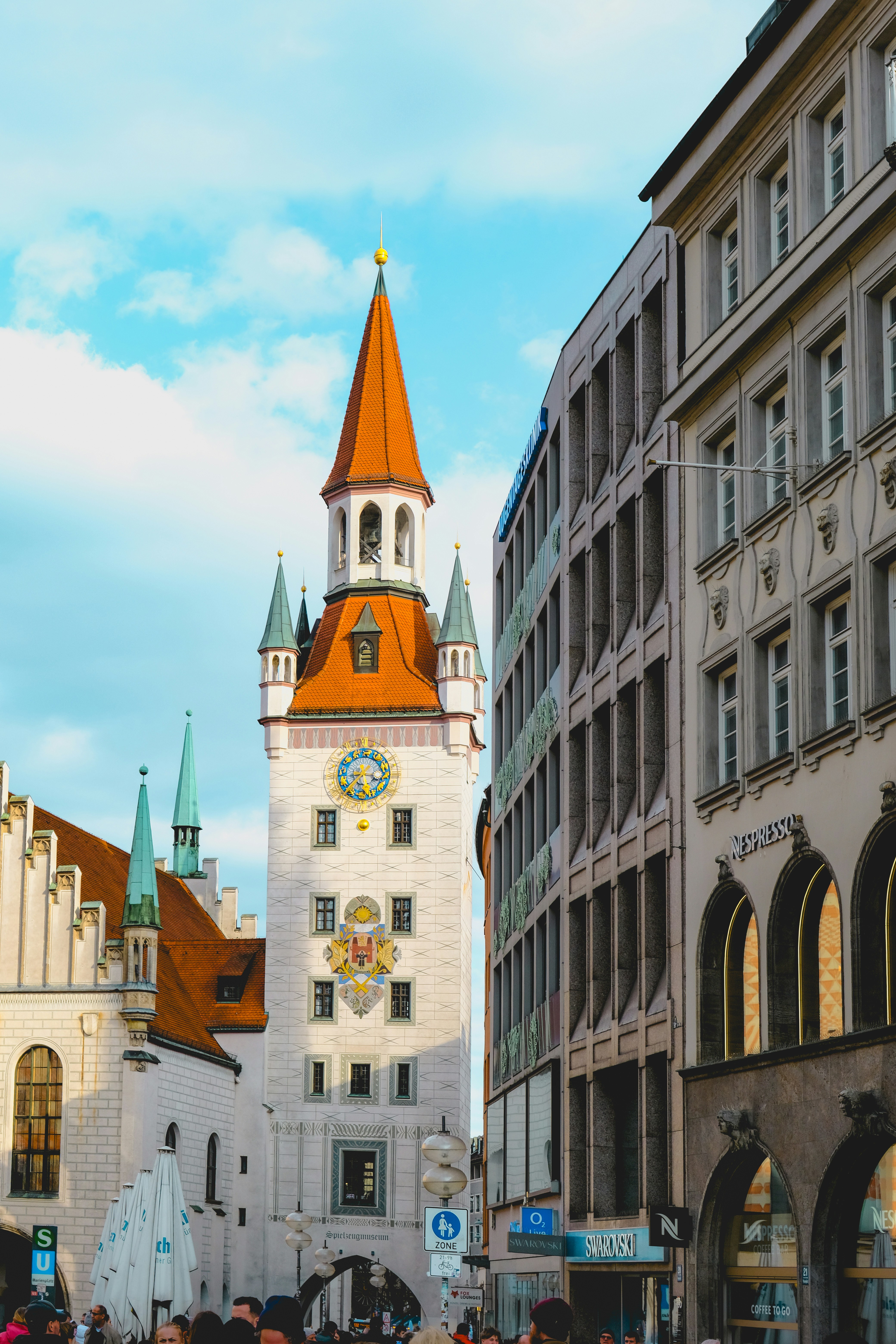 Towering Clock tower in a European streetscape