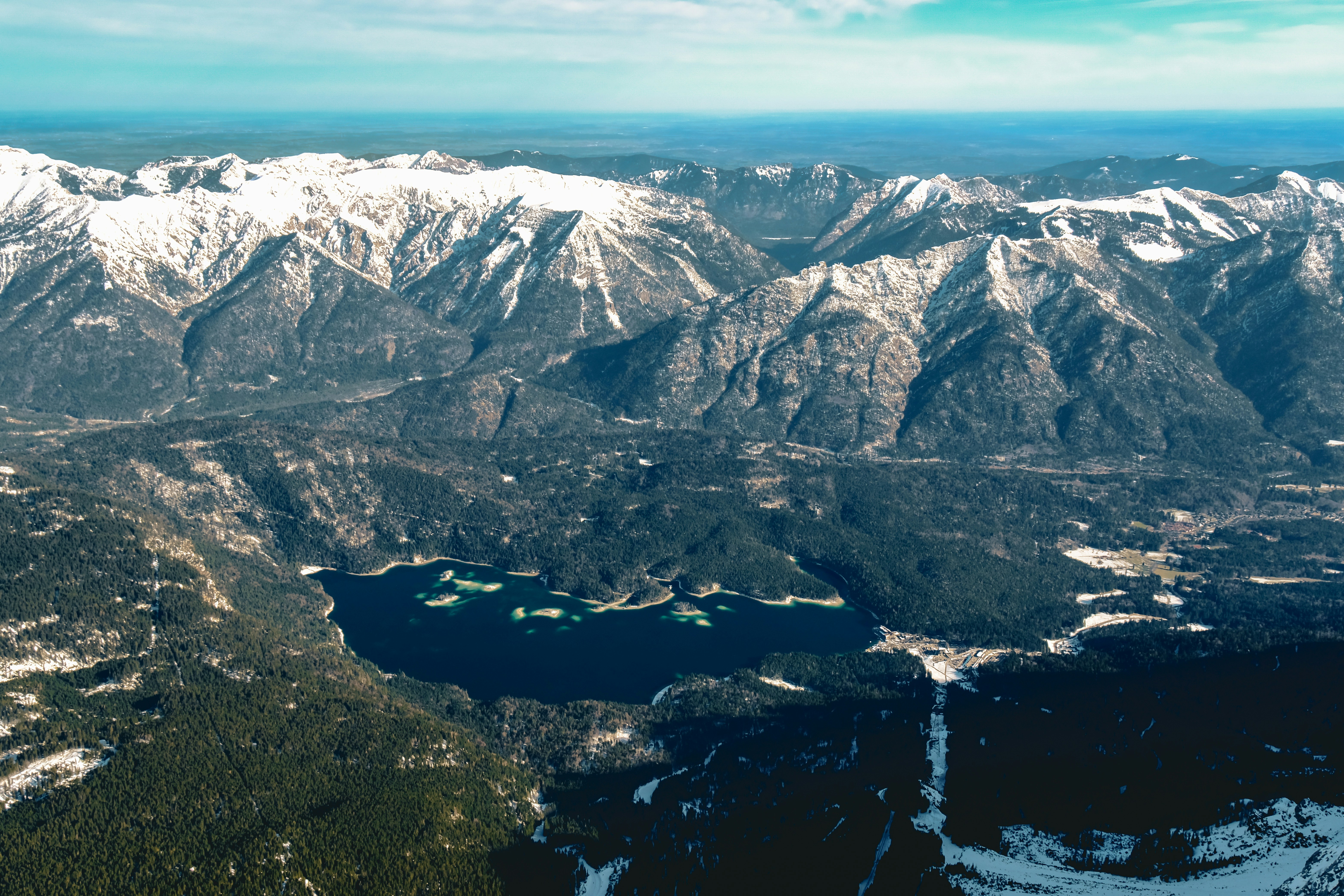 Snow-Kissed Ridge and Serene Alpine Lake