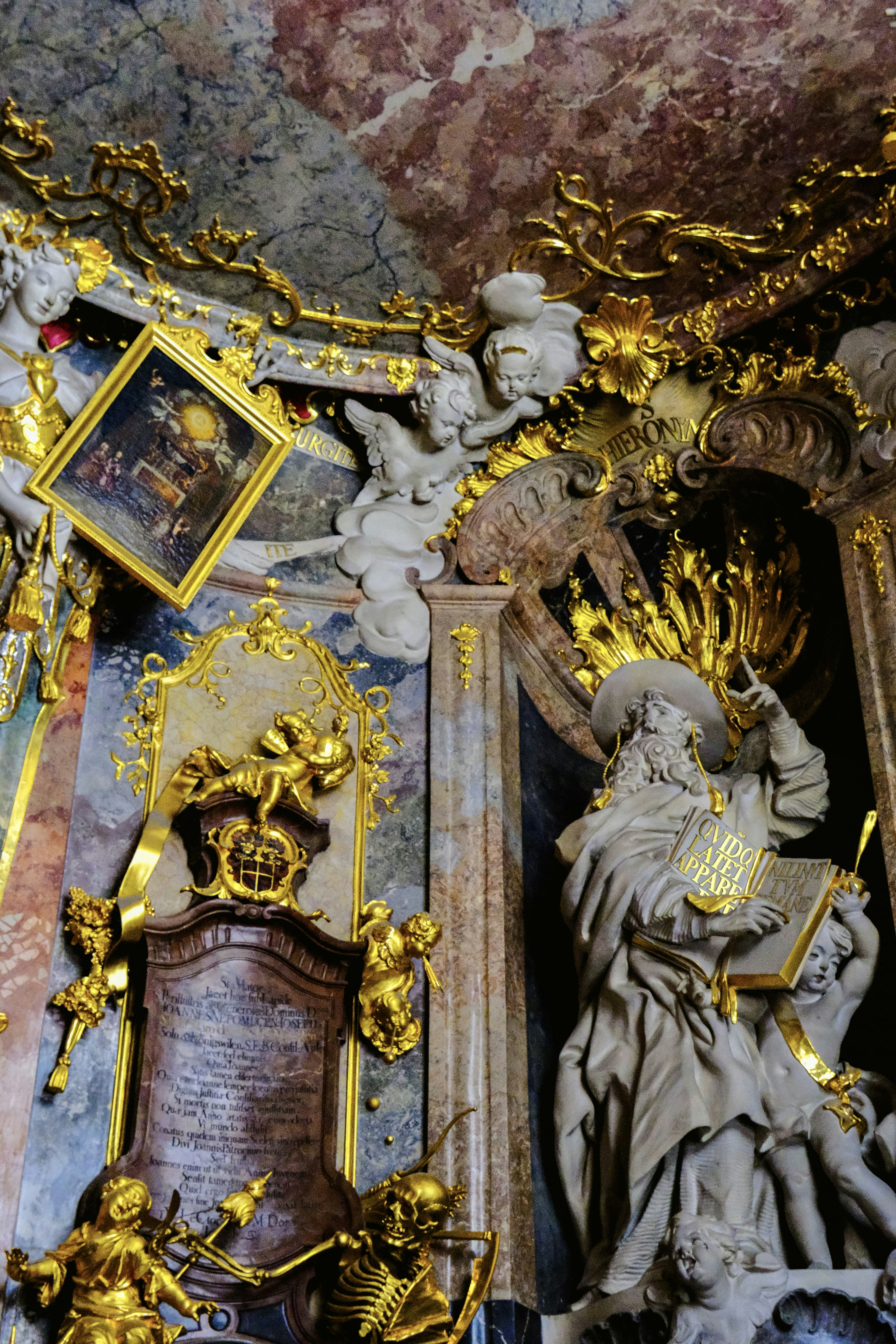 Golden Baroque Shrine: Cherubs, Plaques, and Sculpted Saints in a Rich Cathedral Niche