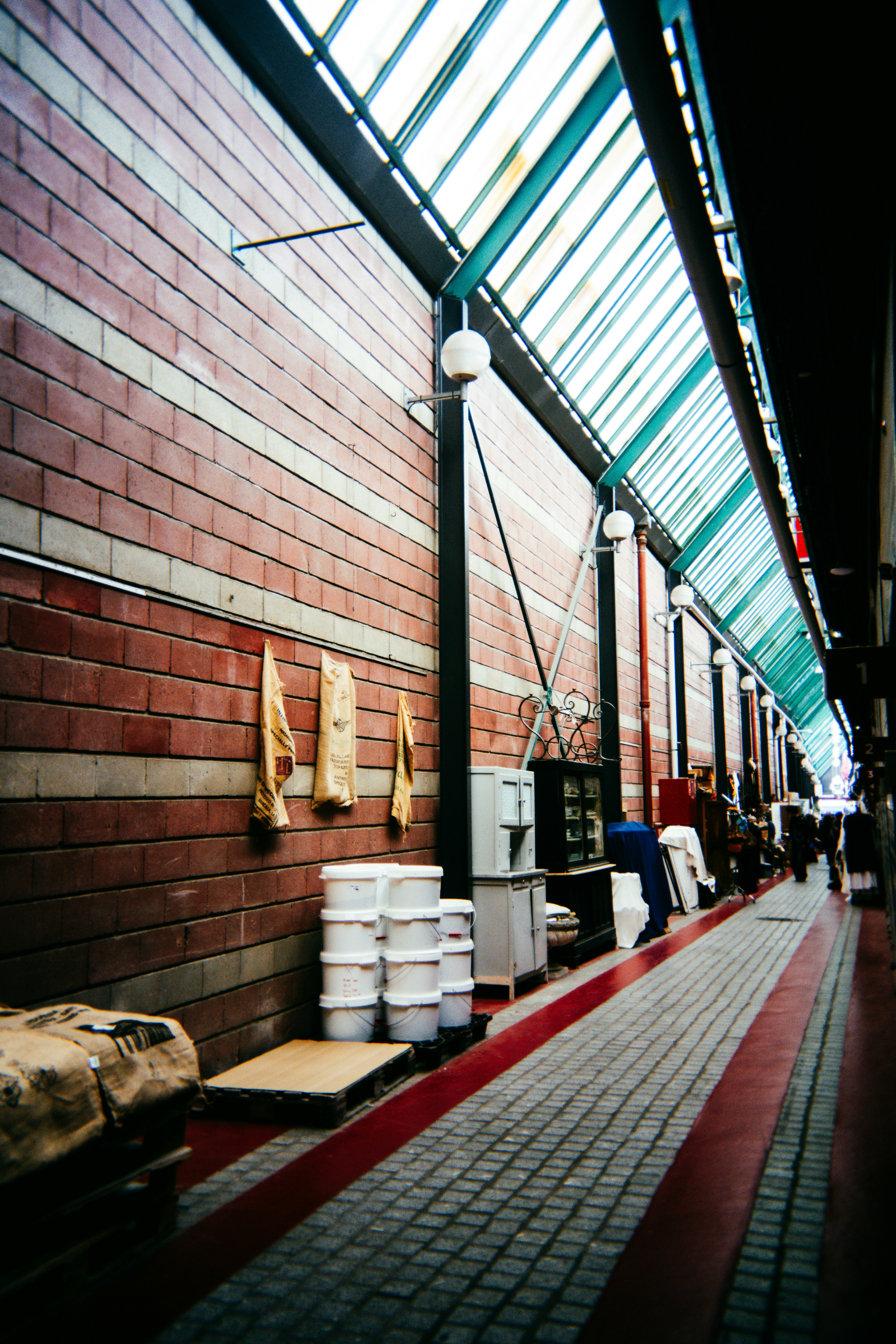 Sunlit Archway Corridor: An Industrial Walk Through Color and Light