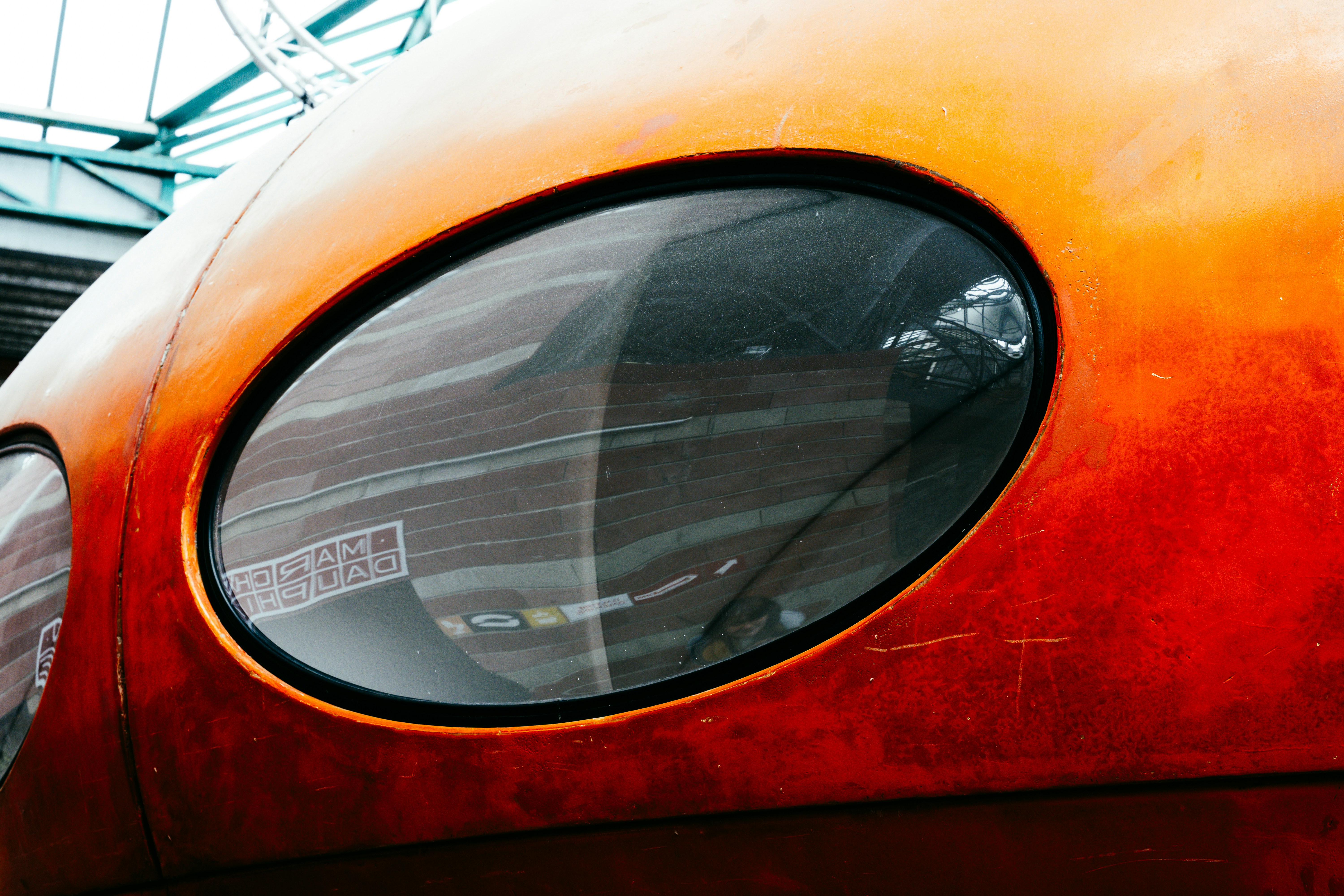 Crimson Capsule: A Close Look at a Rusty Oval