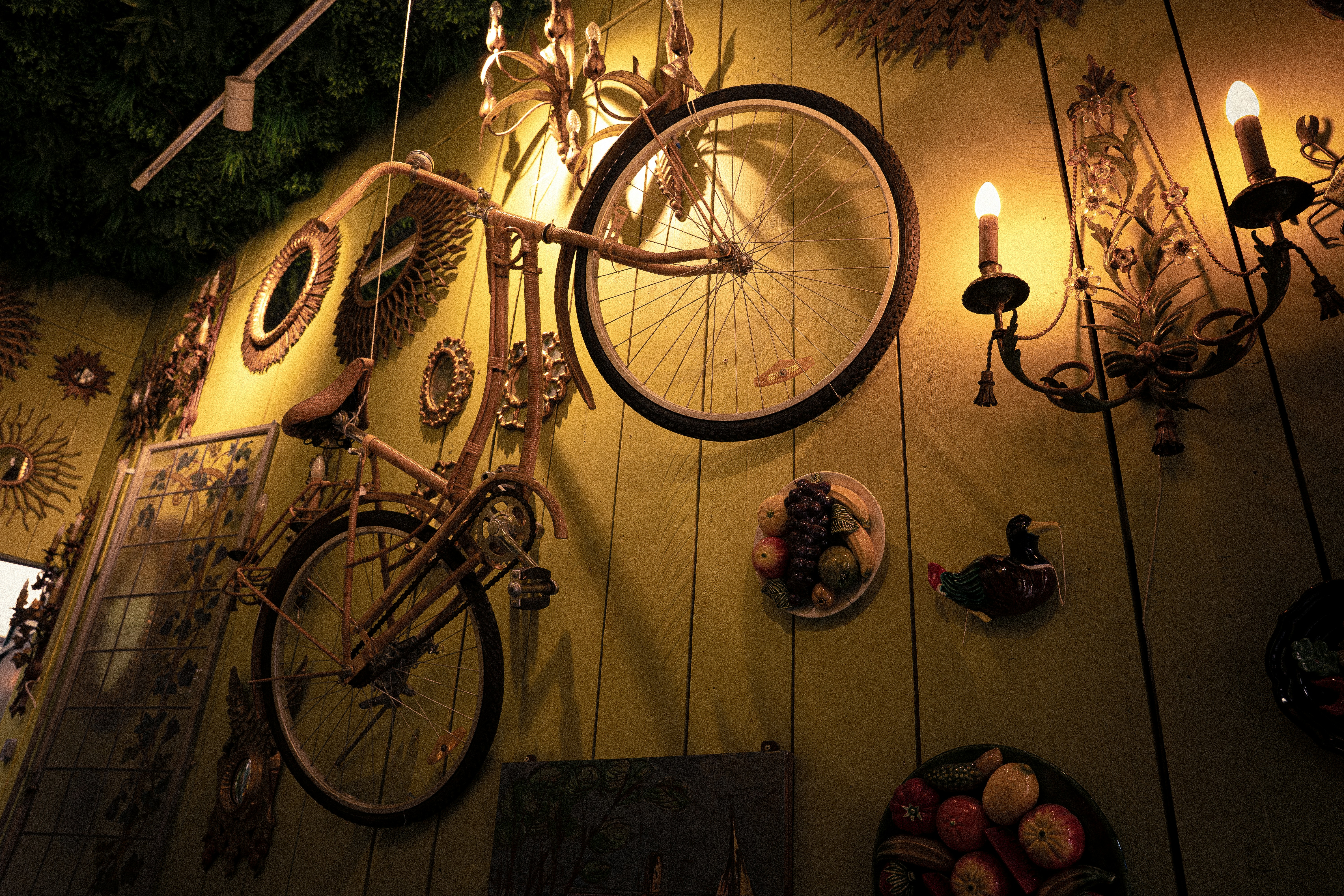 Hanging Time: A Vintage Bicycle Gallery in Warm Candlelight