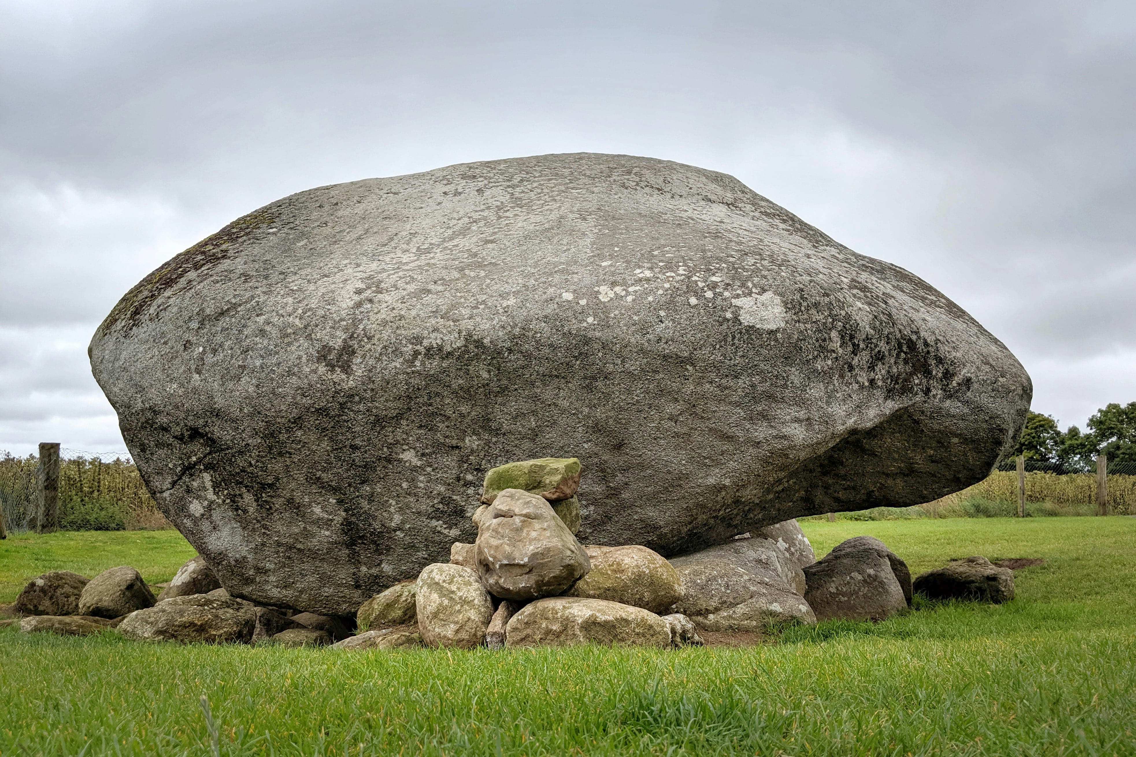 Balanced Boulder: A Giant Rock Resting on a Stacked Ring of Stones