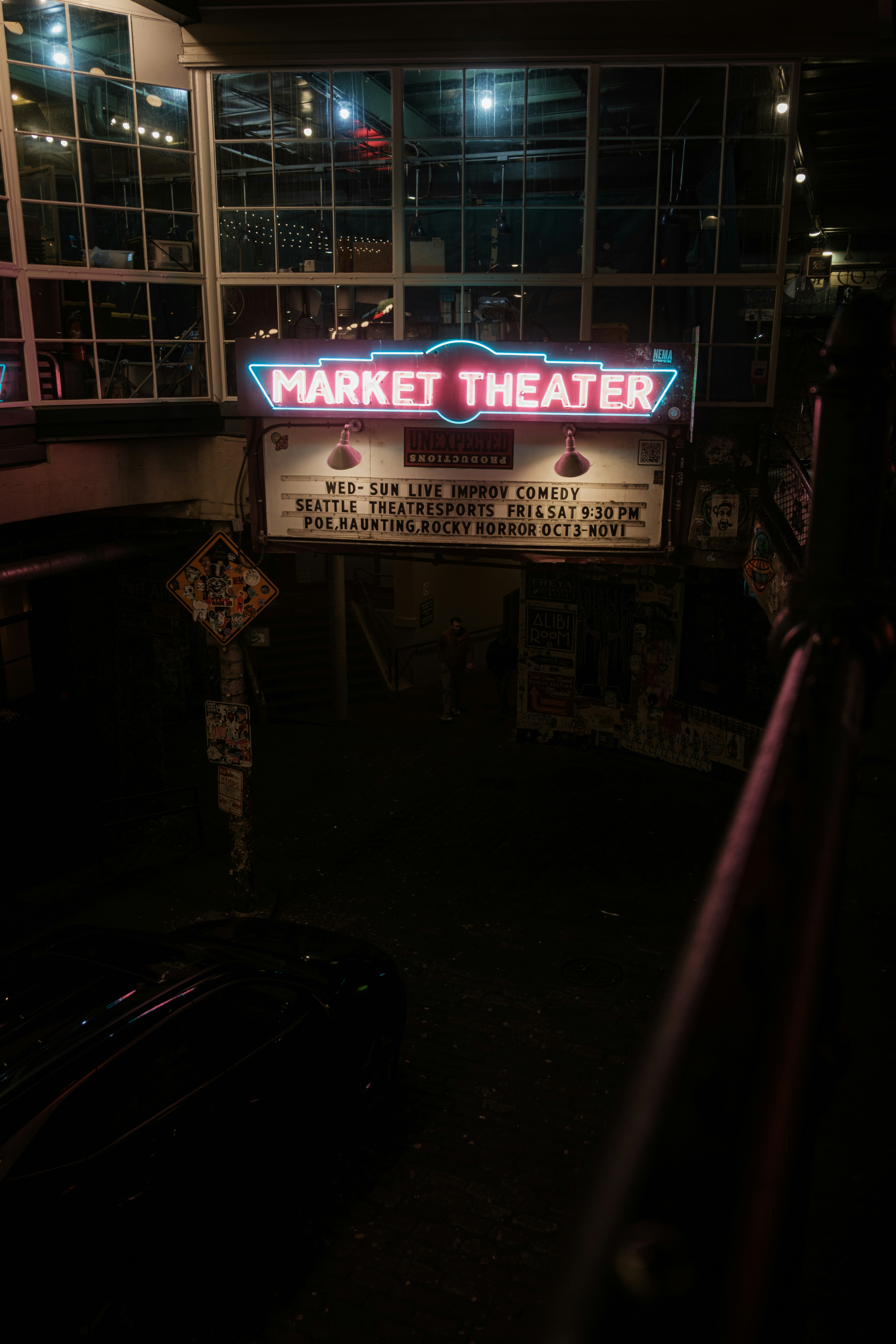 Neon Sign over a Night Market Theater