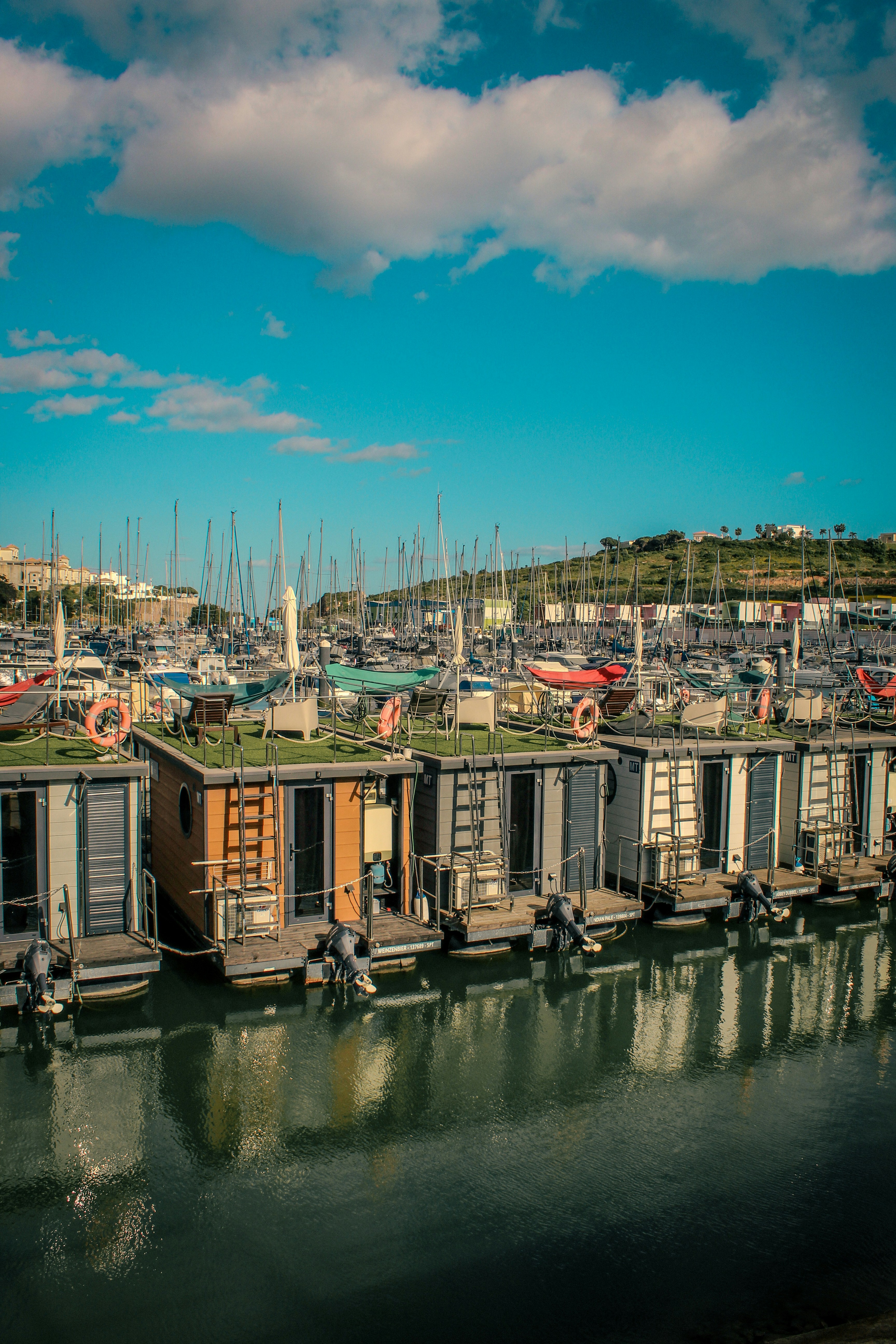 Harbor of Tiny Homes: A Marina of Modern Docks Under Blue Skies