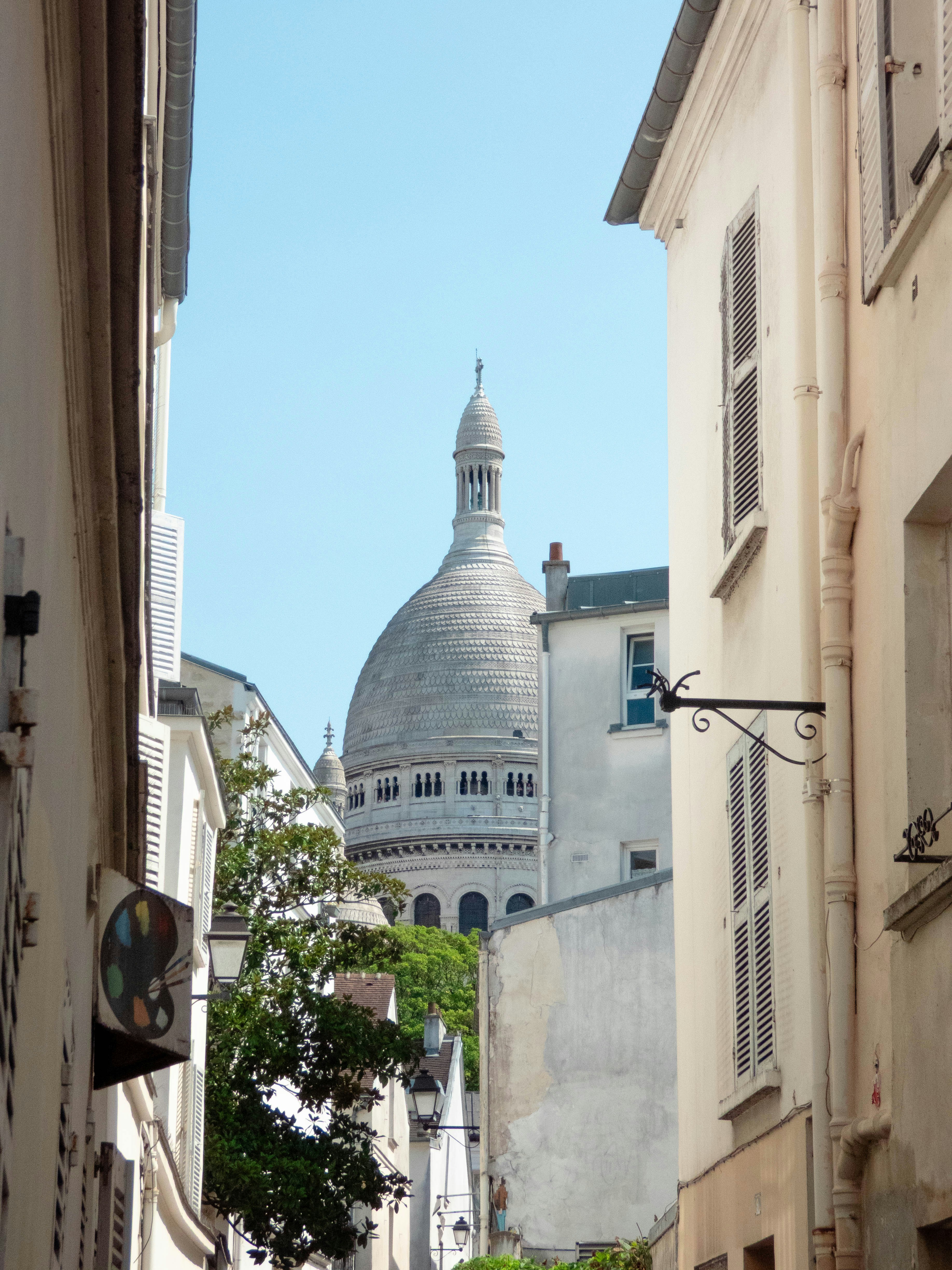 St. Louis Dome peeking over a sunlit Rue