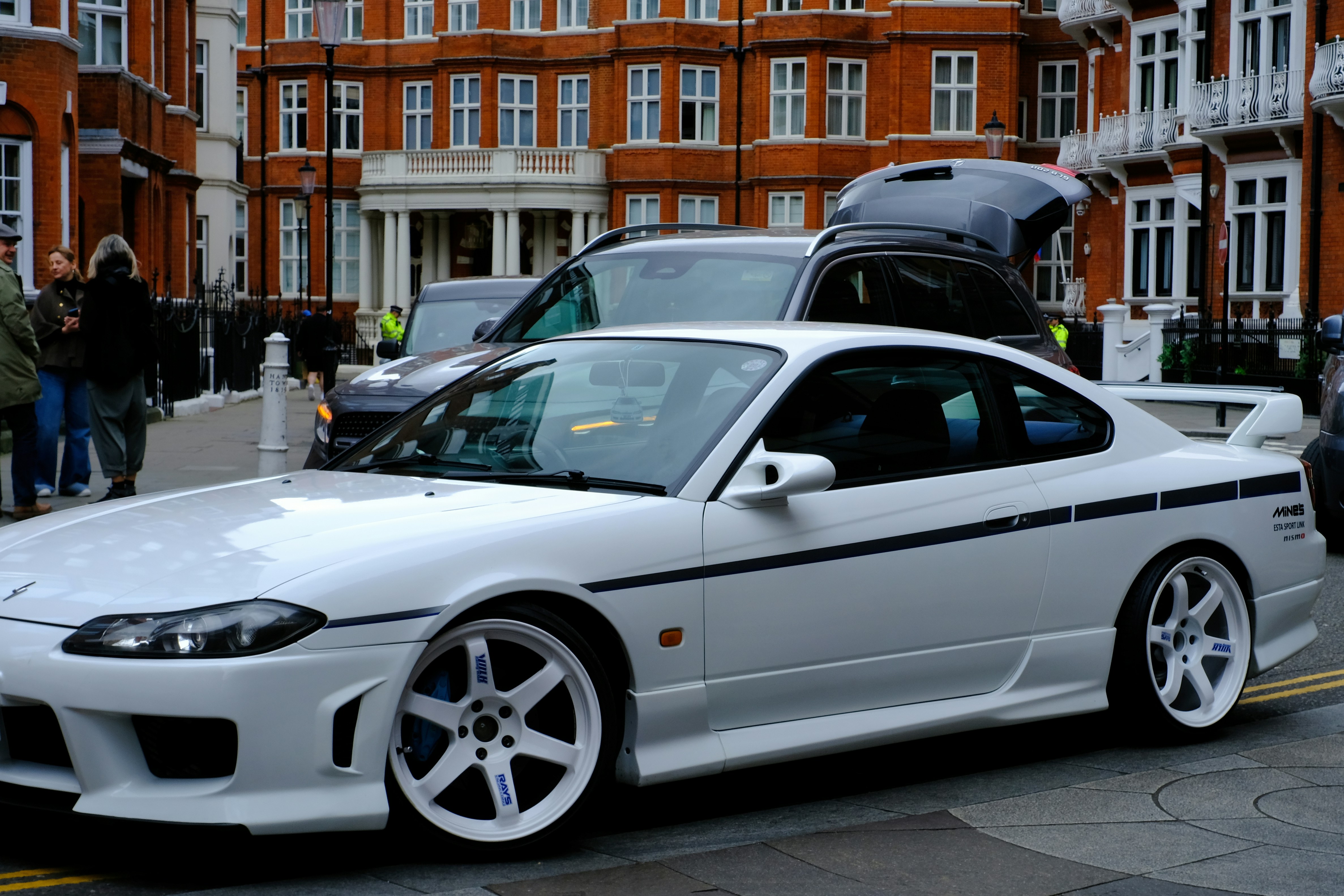 White Japanese-Styled Skyline: A Dressed Street Racing Car on a London Row
