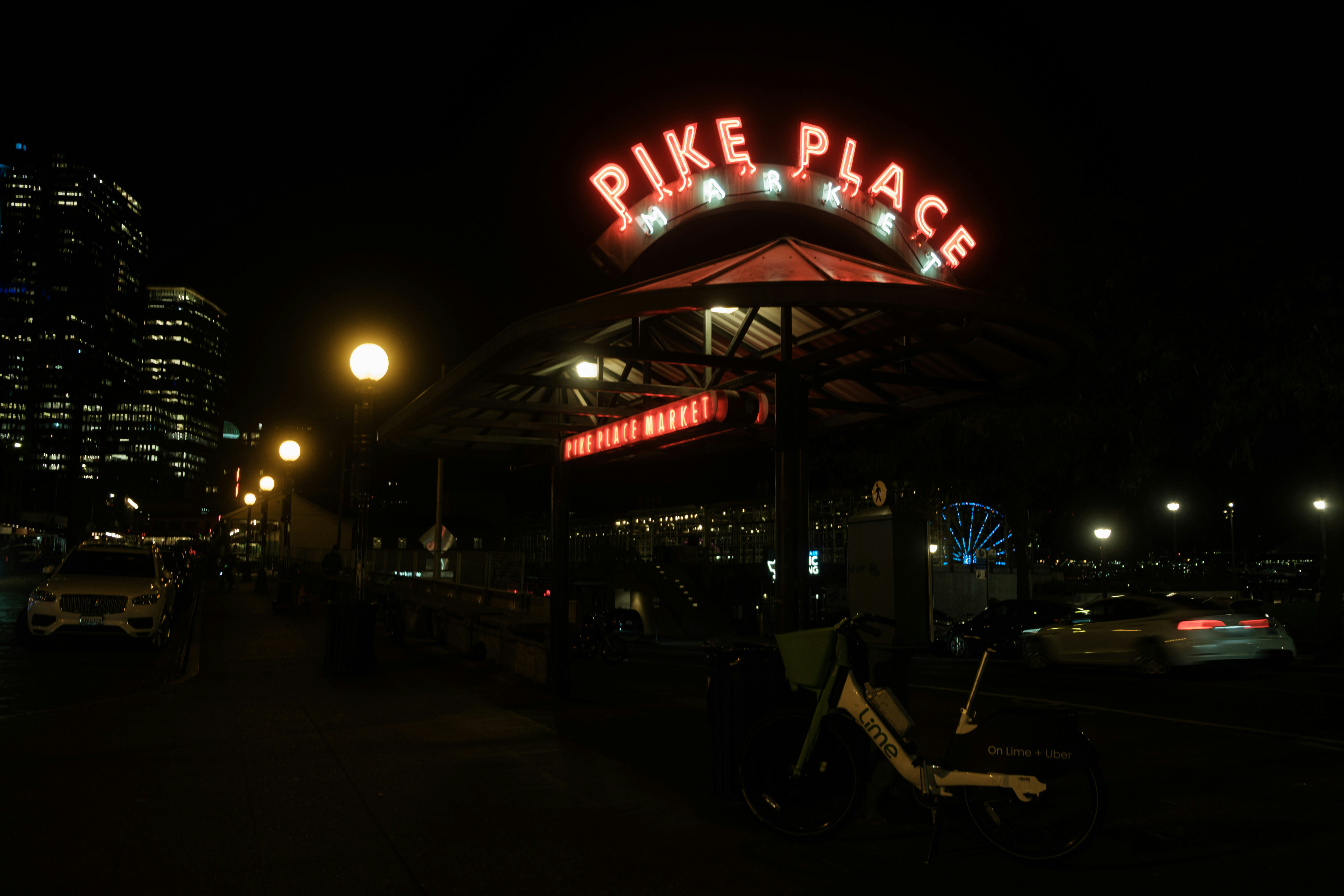 Night Entrance at Pike Place: Neon Glow Over the Quiet Transit Hub