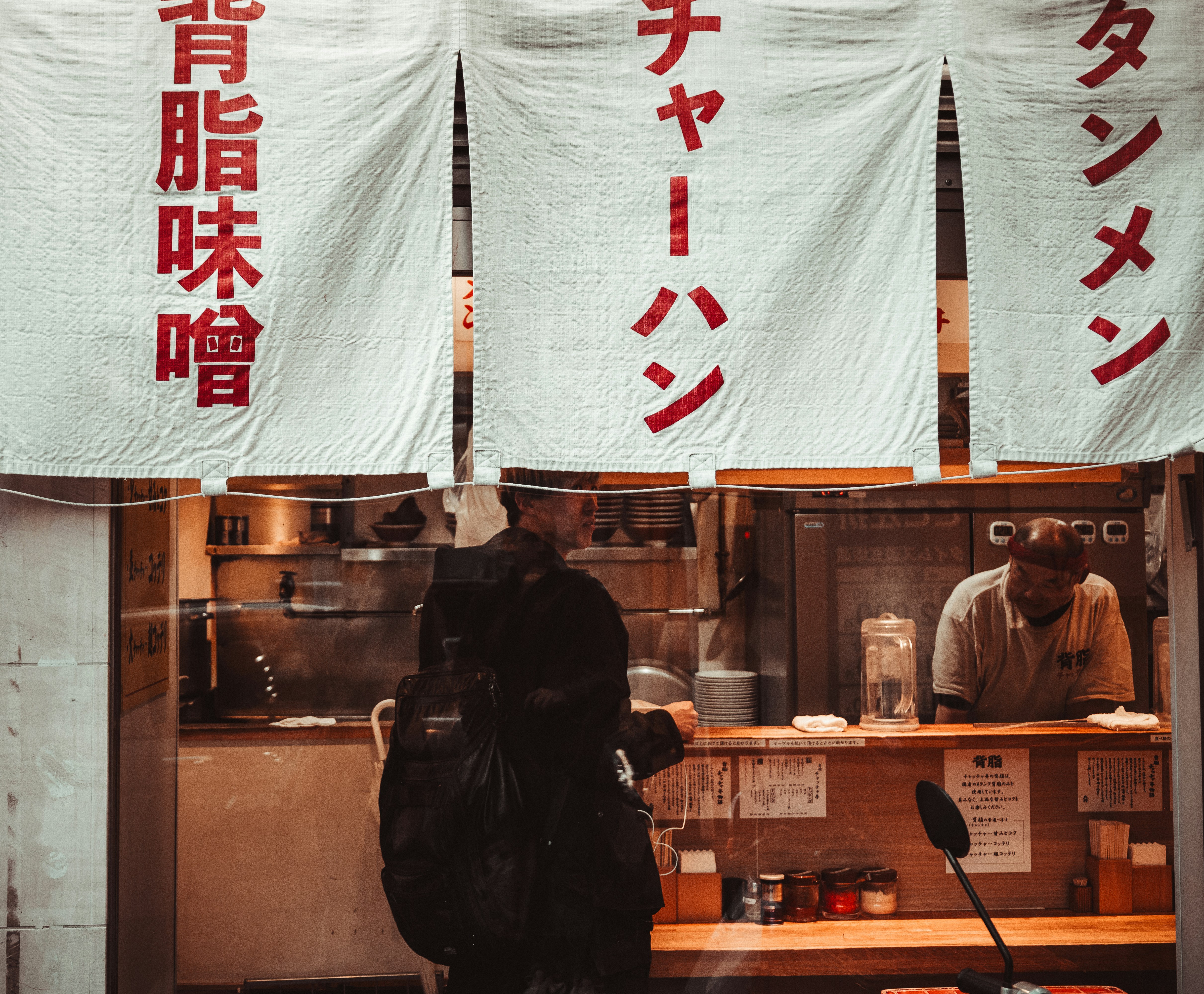 Quiet Window, Busy Kitchen: A Moment Behind the Narrows of a Japanese Noodle Stand