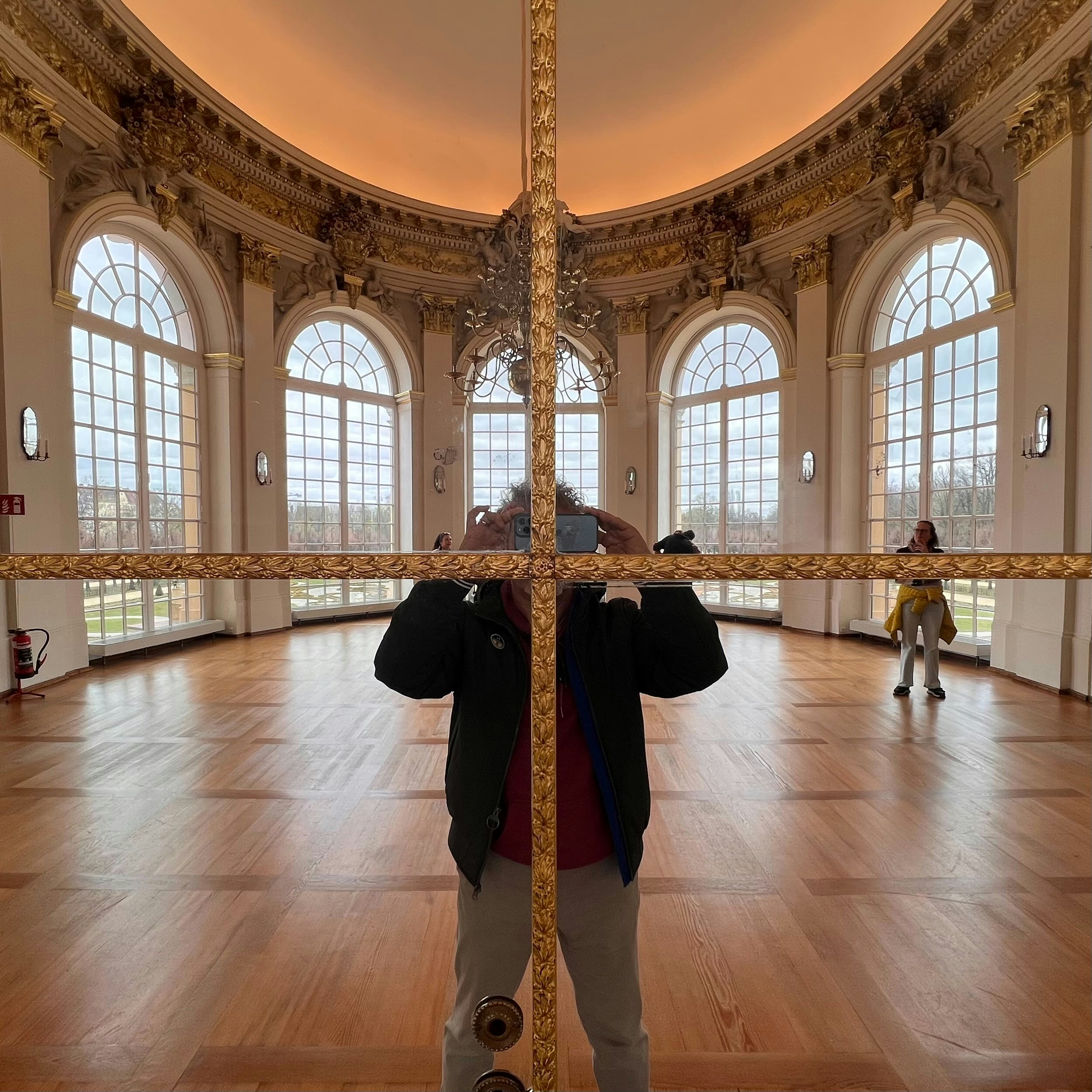 Golden Crossbars and Grand Hall: A Mirror Image in the Atrium