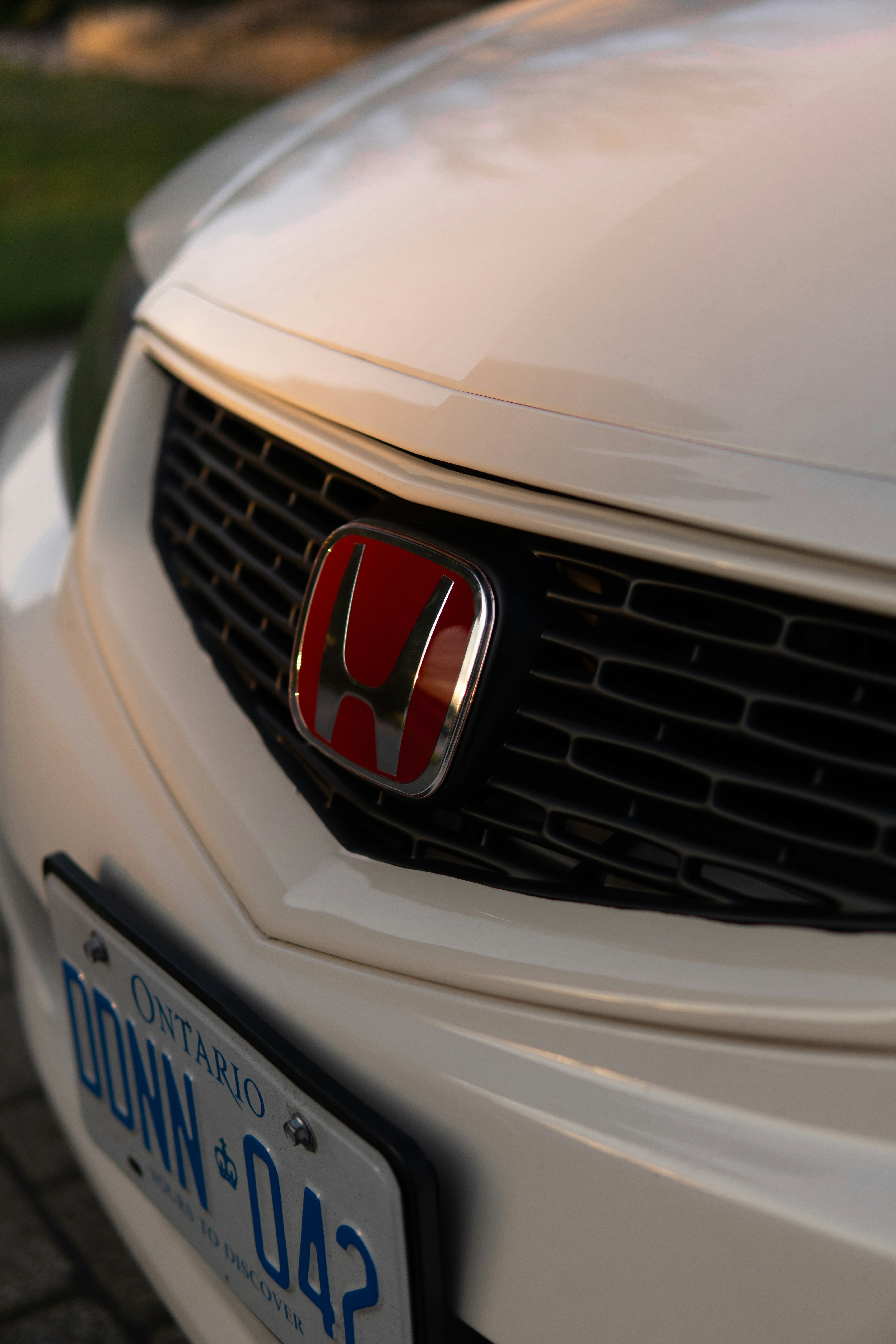 Honda Emblem in Focus: A Close-Up of the Front Grille and Hood