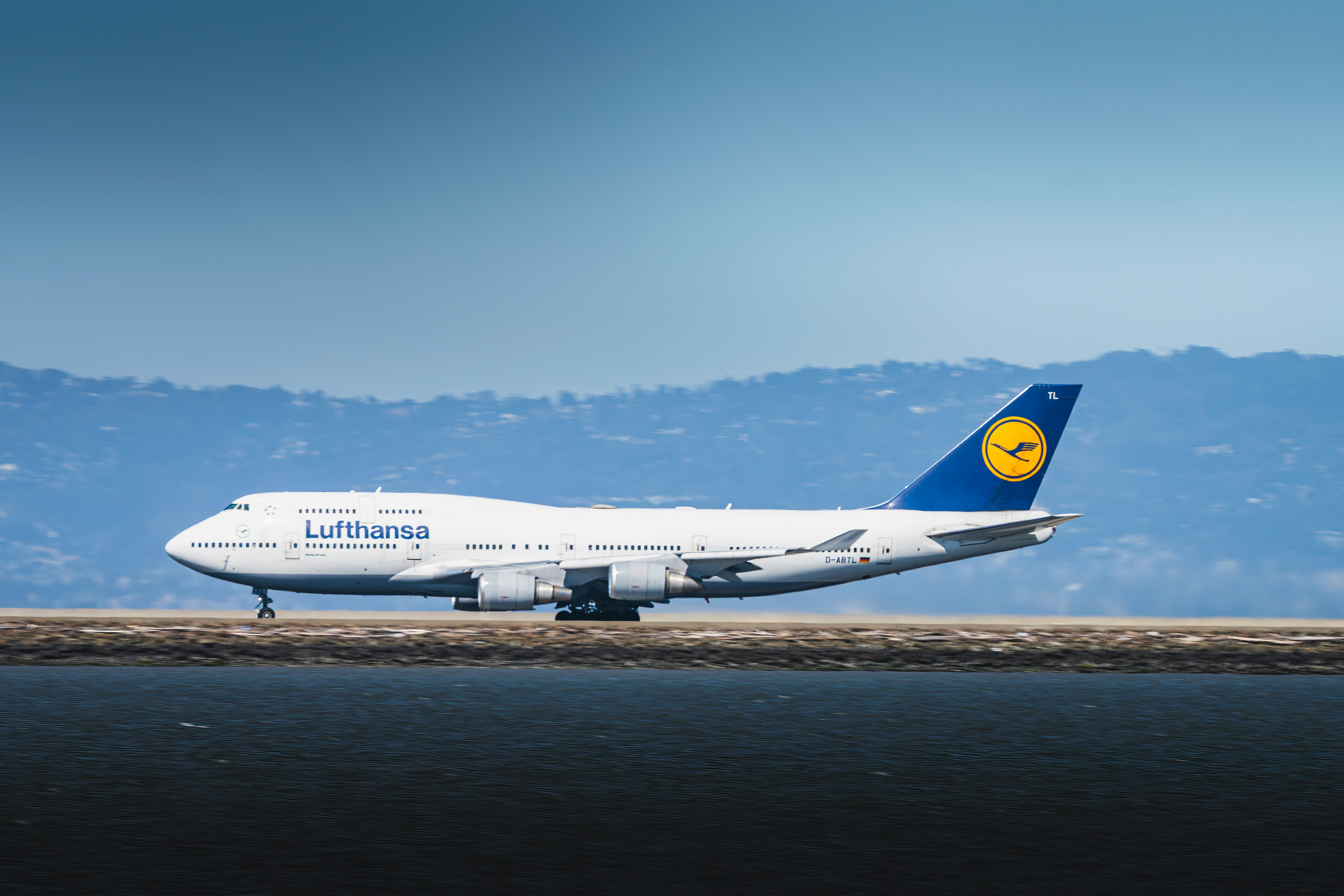 Lufthansa Jumbo in Quiet Glide Across a Shoreline