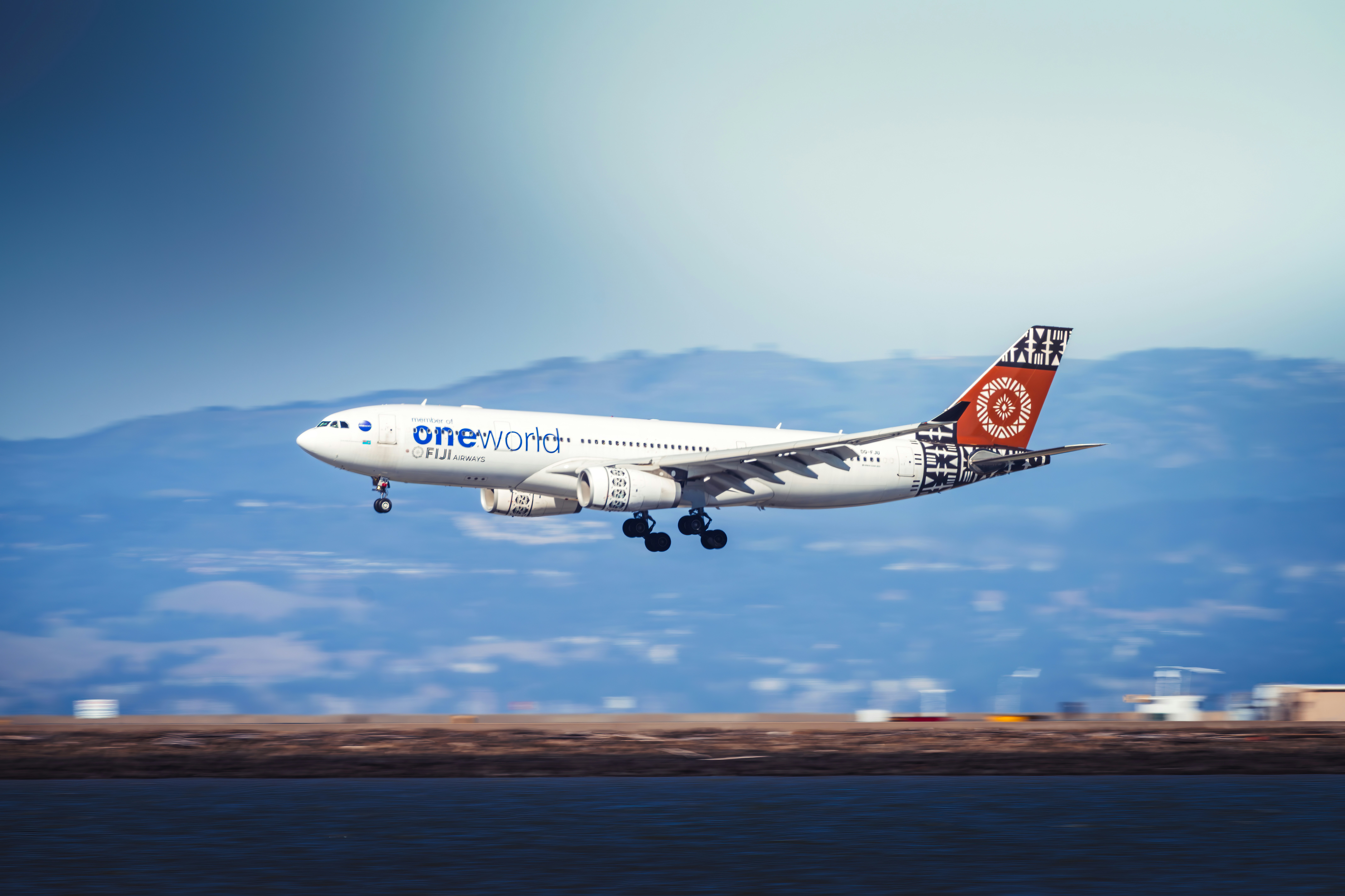 Departure in the Blue: One World A320 Lifts Off