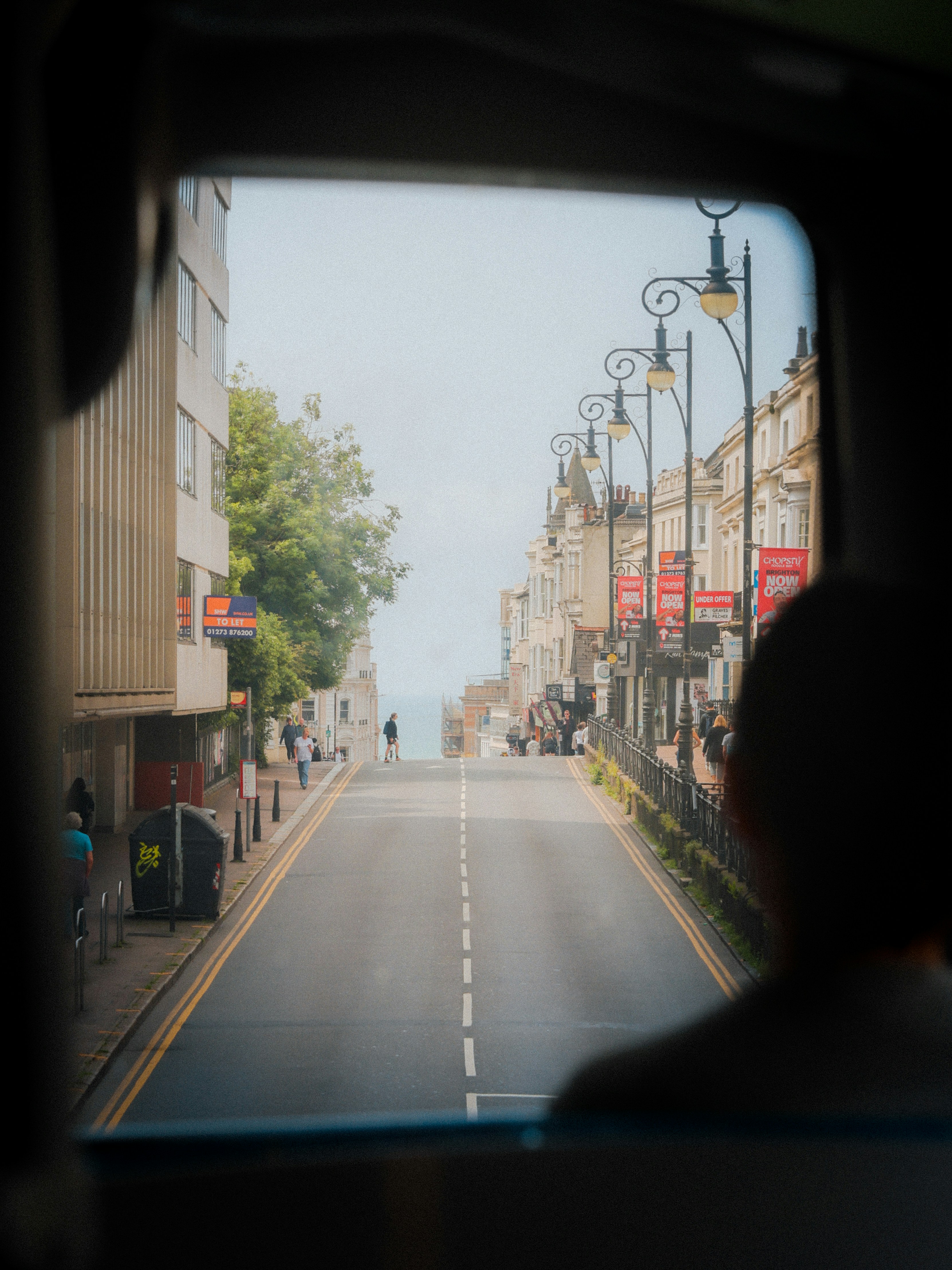 Street in Focus: A City Corridor Framed by Retro Lamps