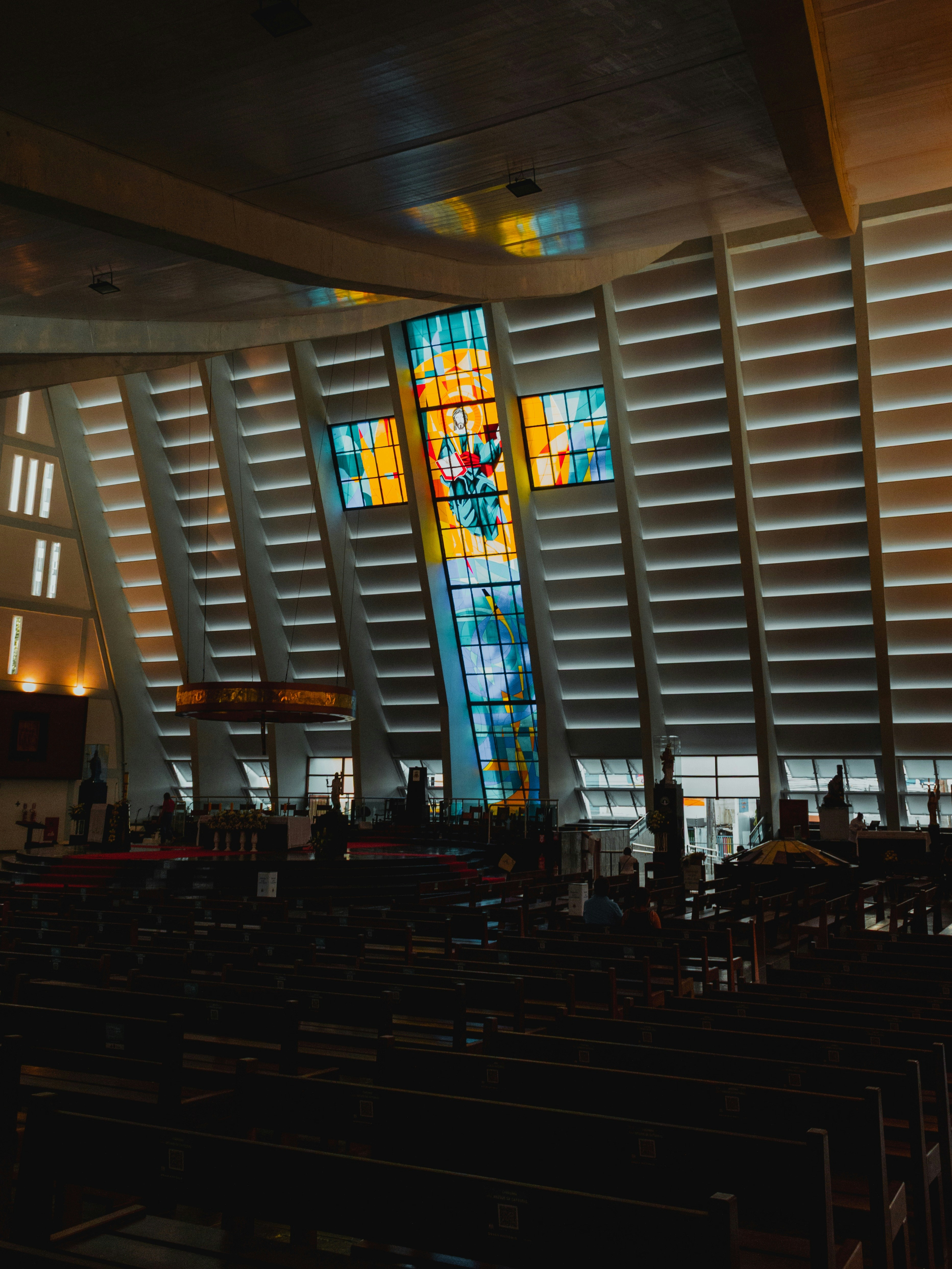 Stained Glass Halo Over an Empty Sanctuary