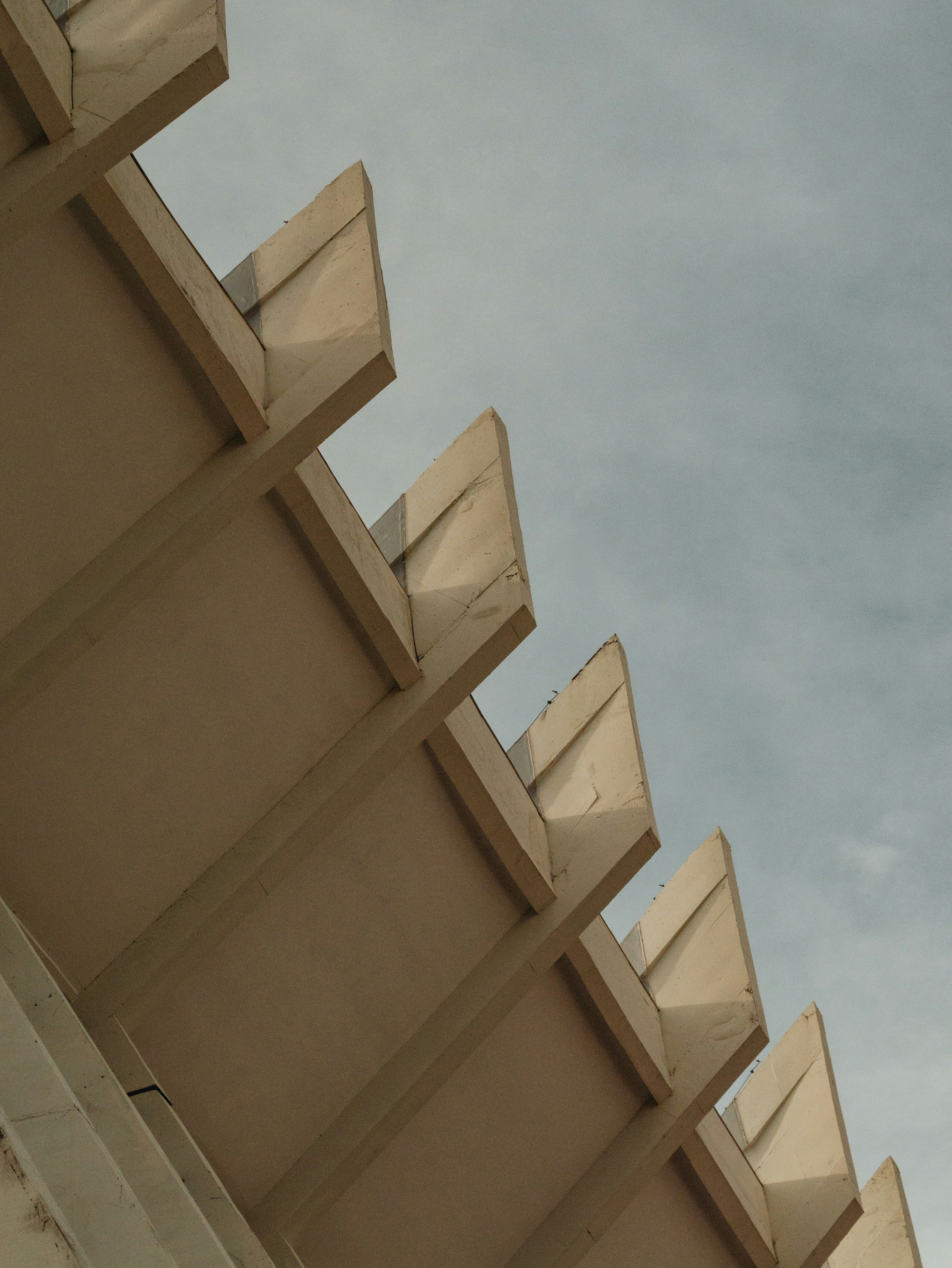 Architectural Fins Against a Calm Sky