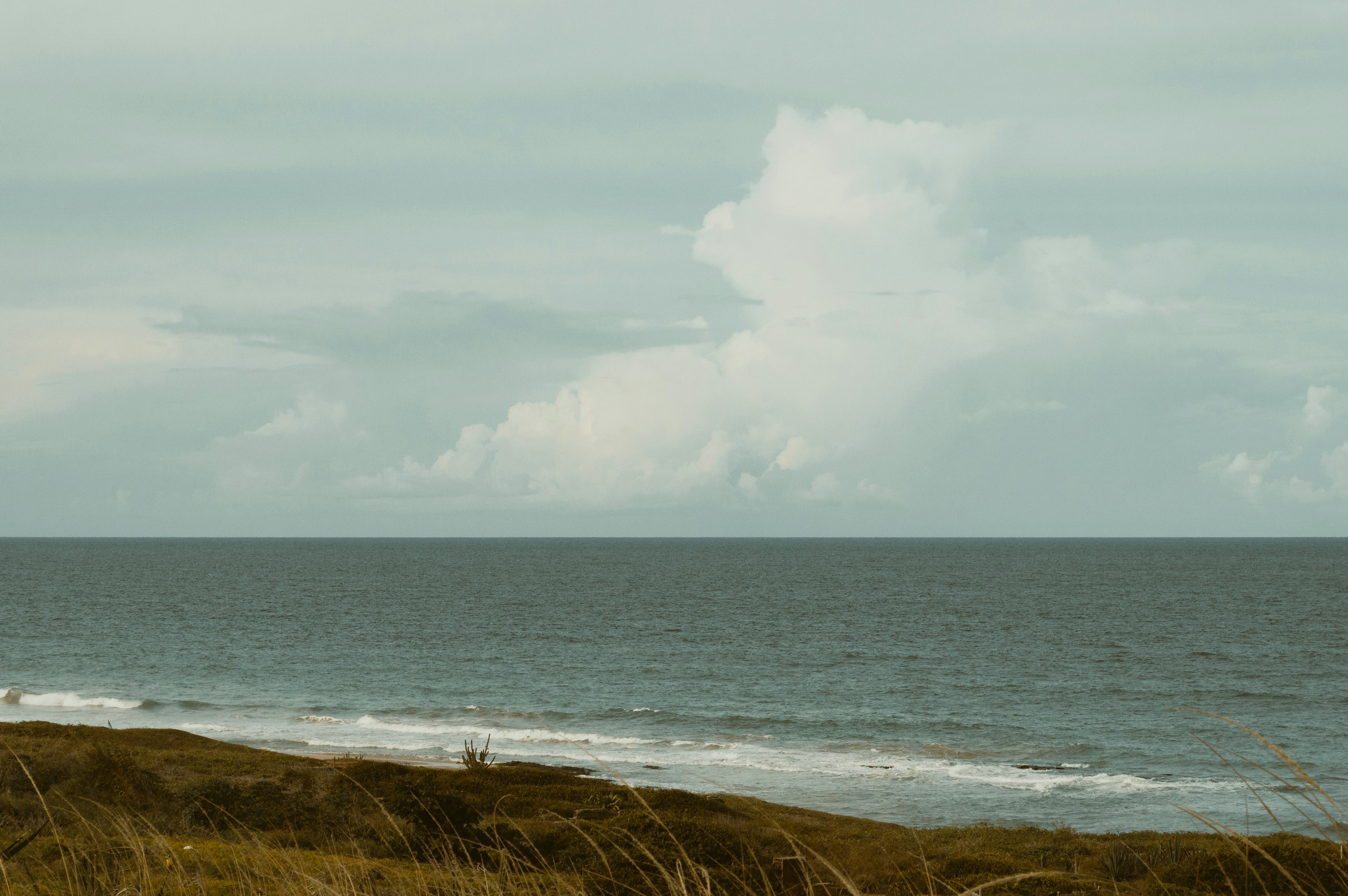 Coastal Horizon Under Soft Sky