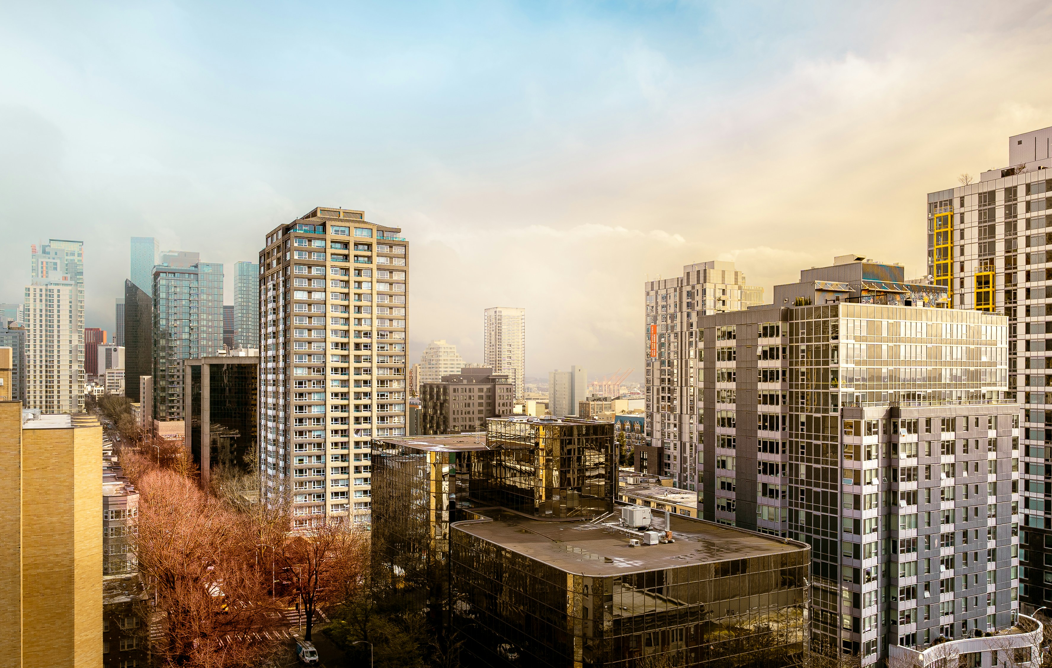Sunlit Skyline Through Morning Mist