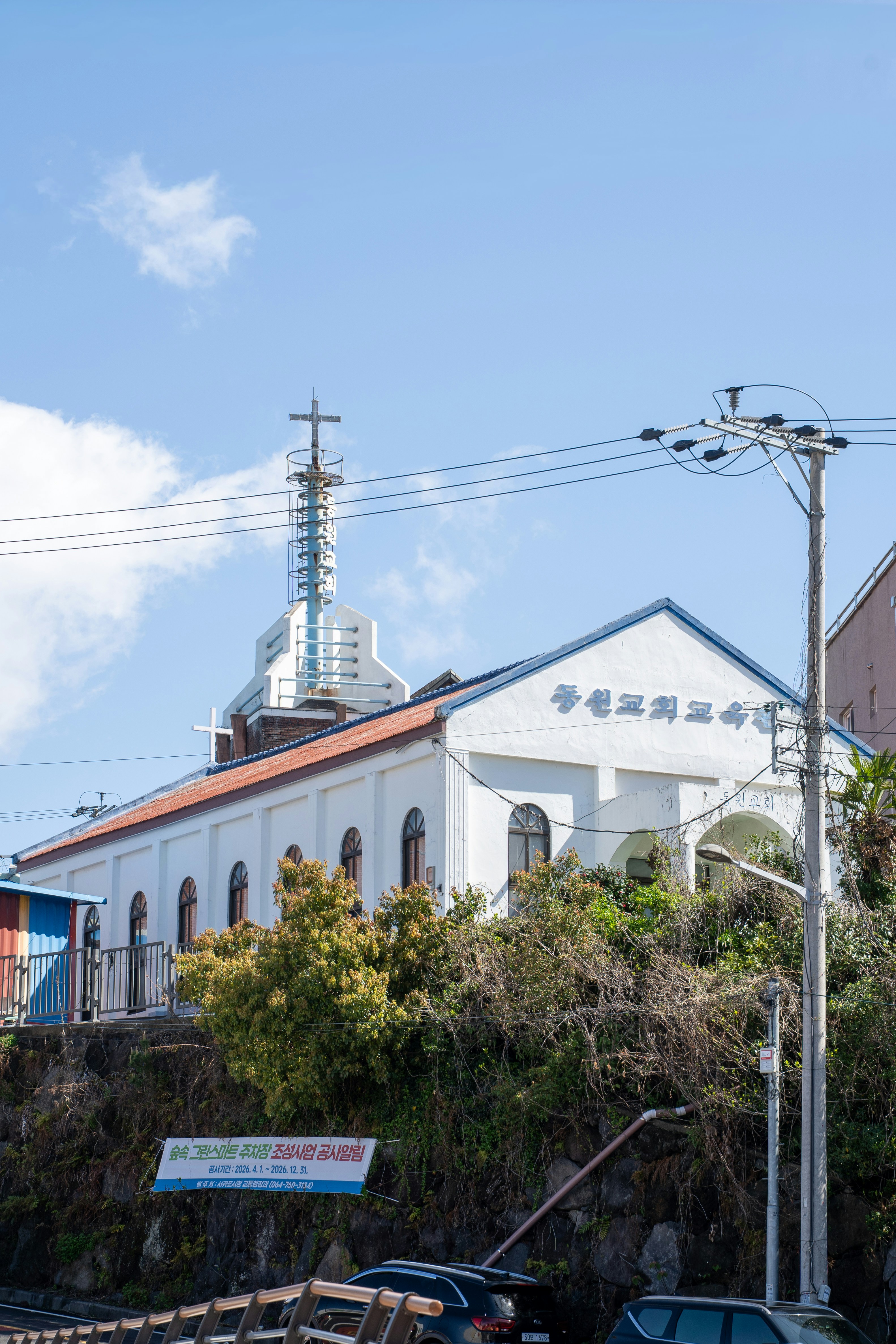 Village Church Under a Clear Urban Sky