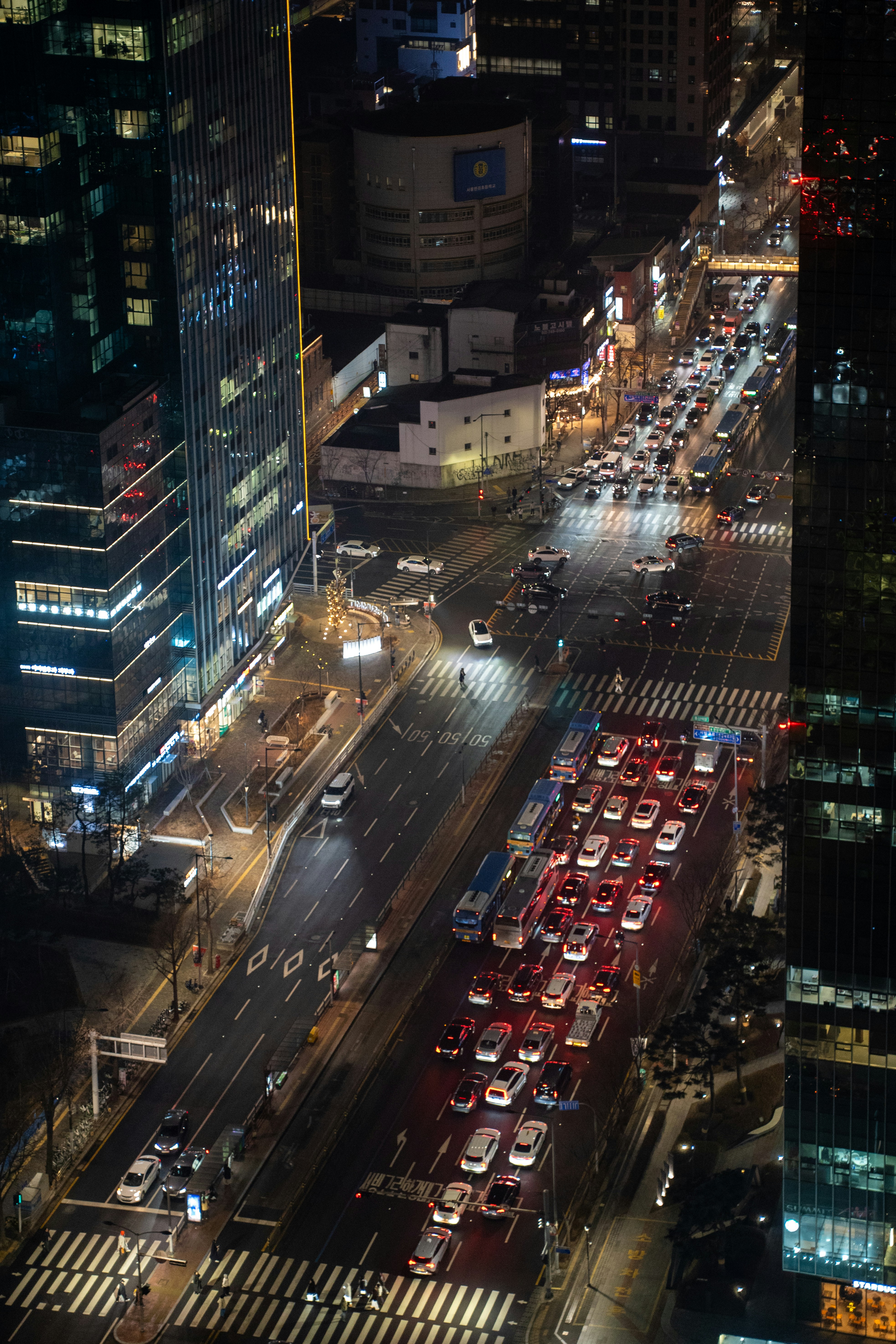 Night Grid: Neon Veins of a Busy Downtown Intersection