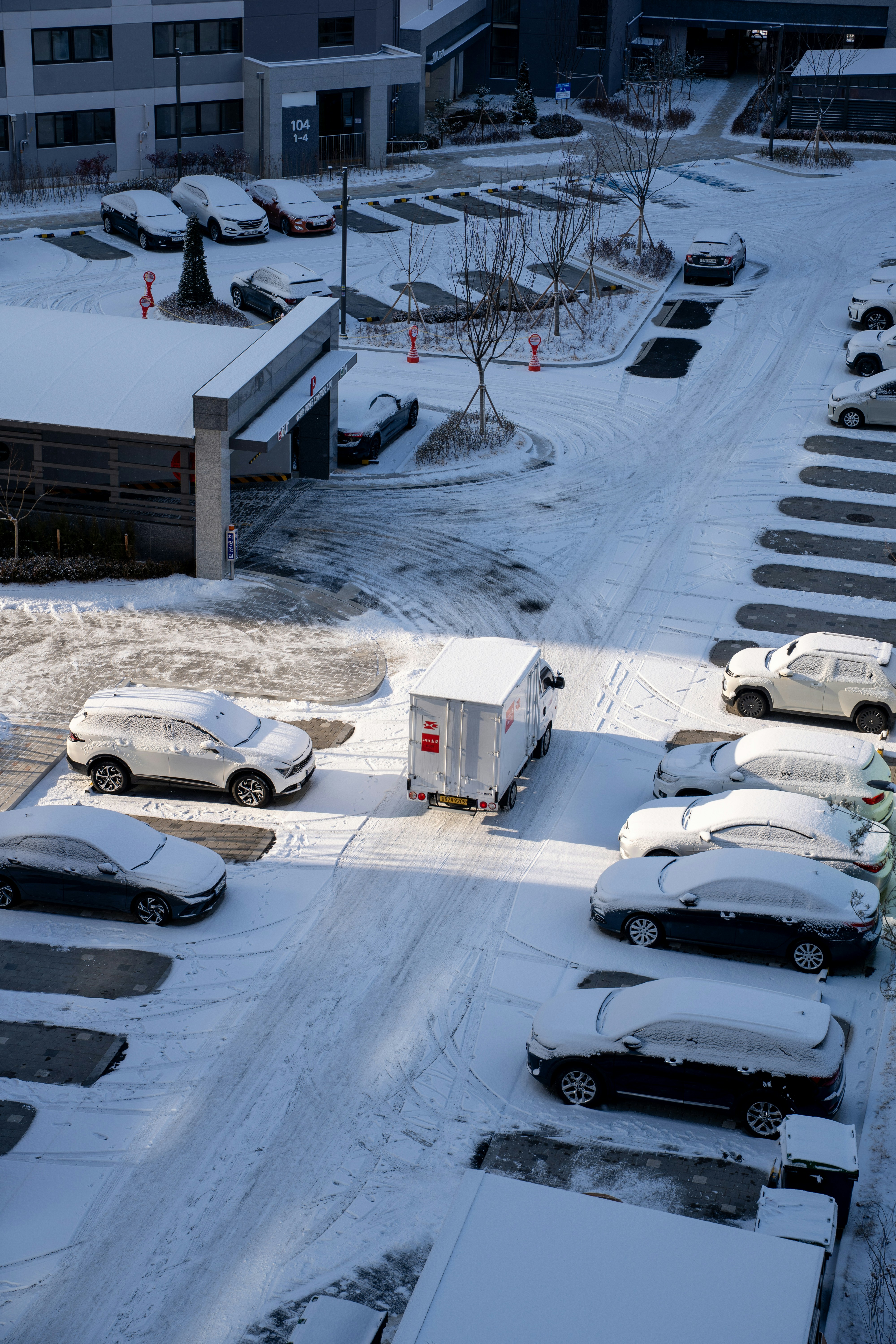 Snow-Covered Parking Lot from a Roof-Top Perspective