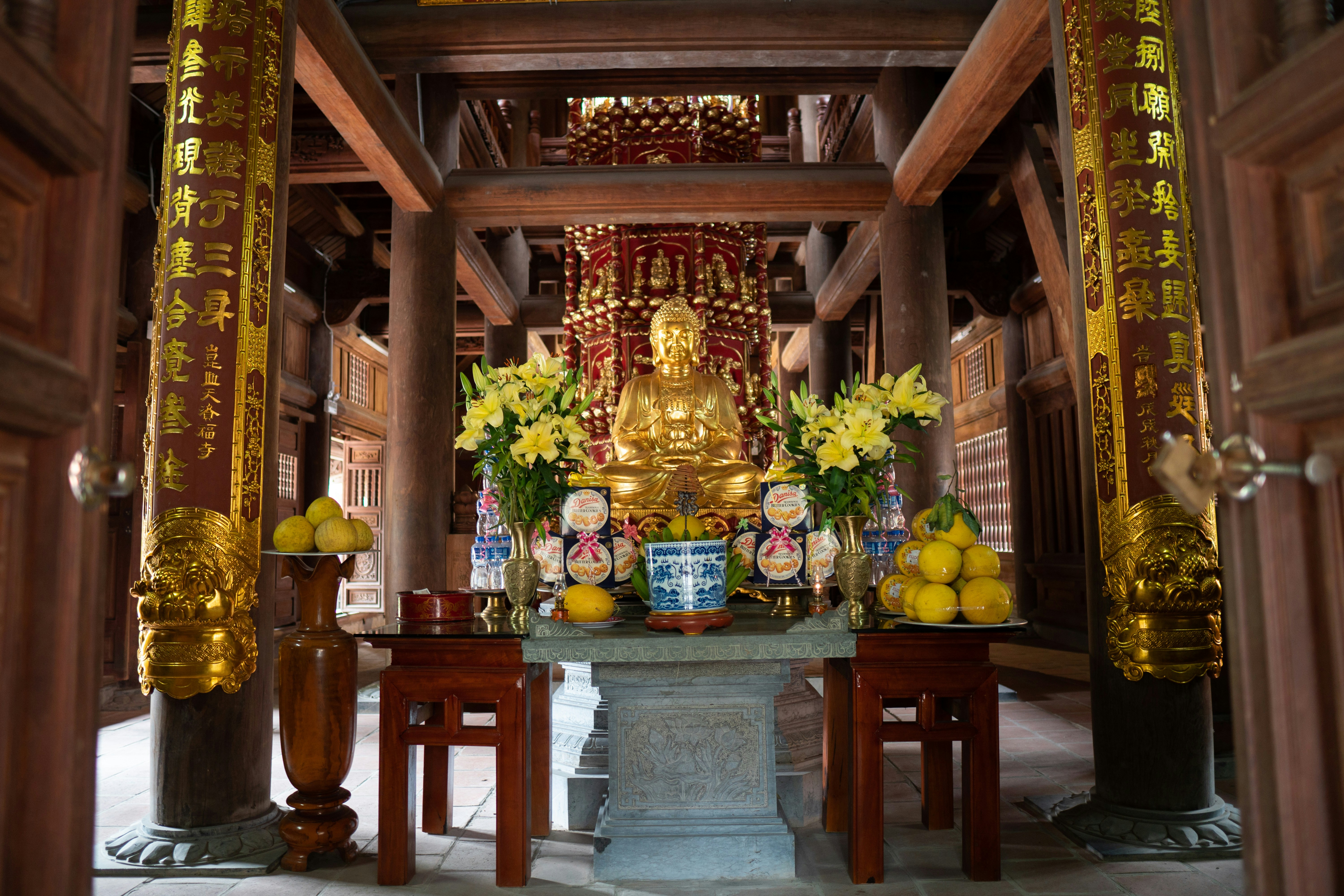 Golden Buddha Shrine Centered in a Wooden Temple Hall
