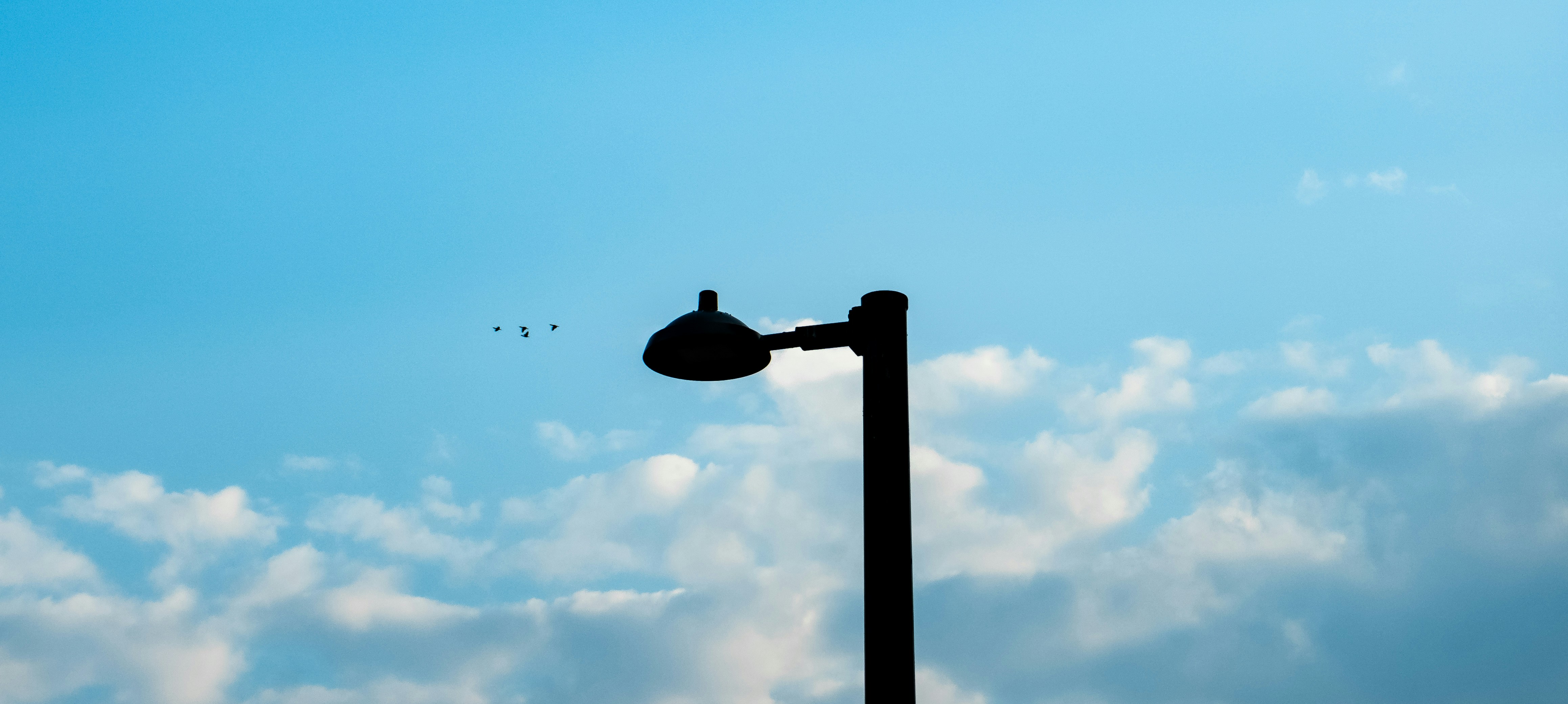 Single Lantern Against a Vast Blue Sky