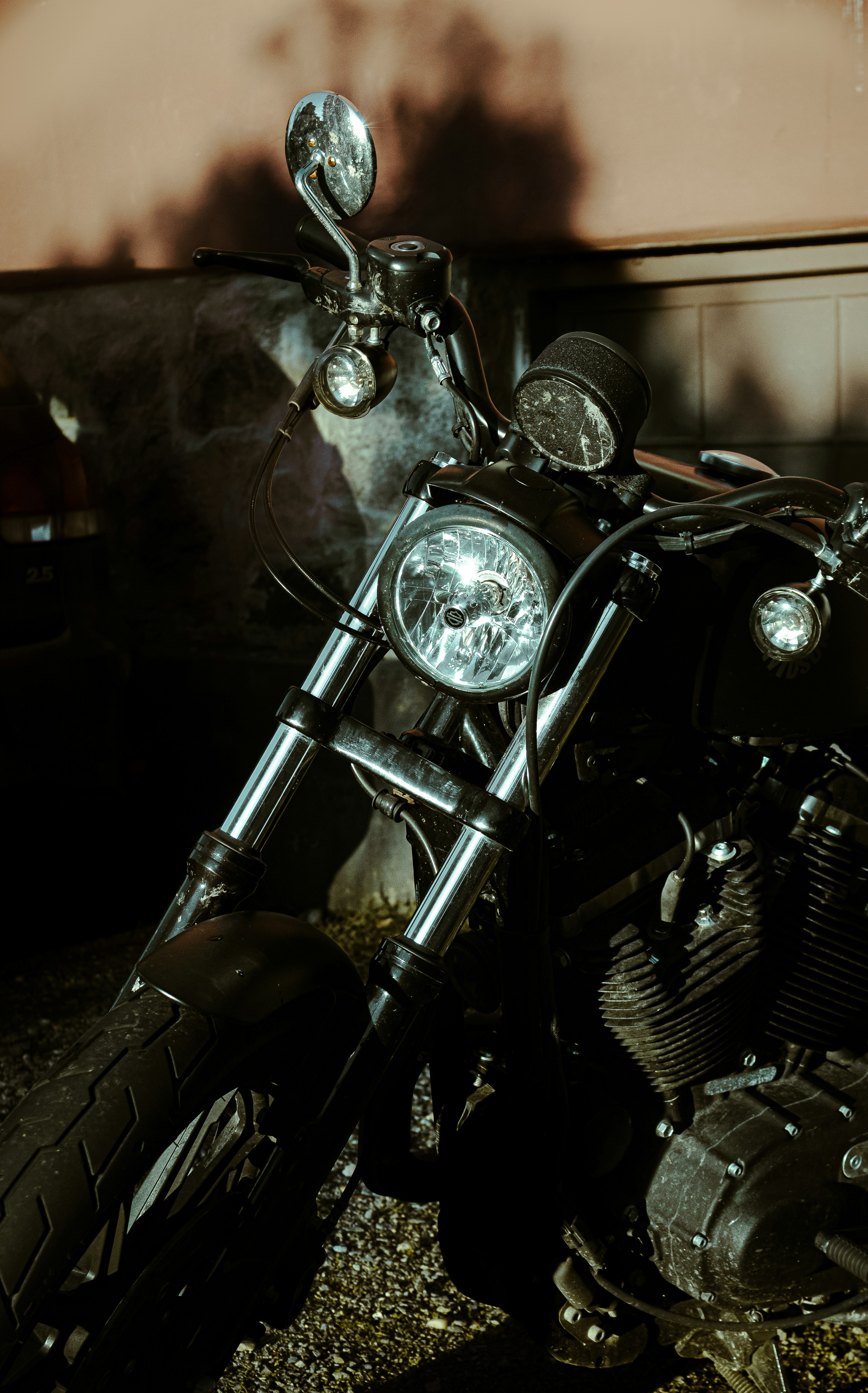 Midnight Ride: A Weathered Harley Quietly Guarded by Shadow
