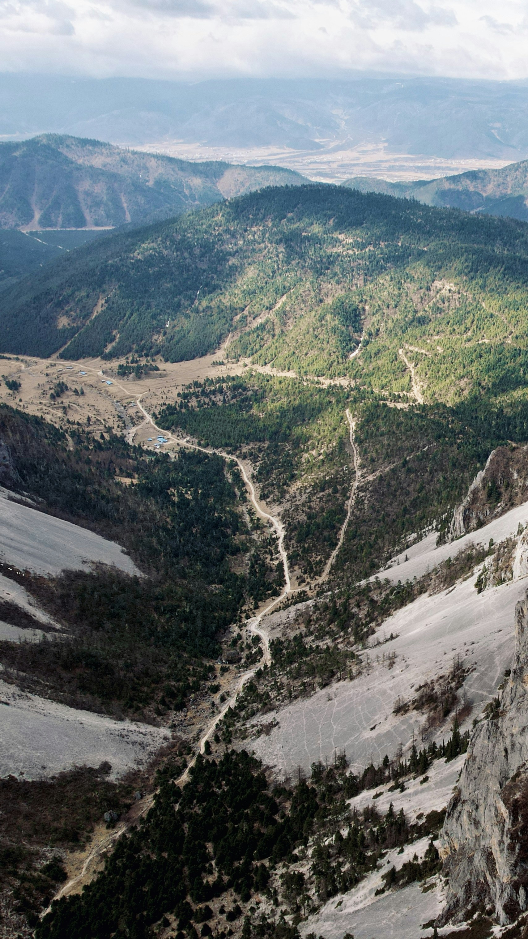 Aerial Tapestry: Mountain Valleys Woven by Trails