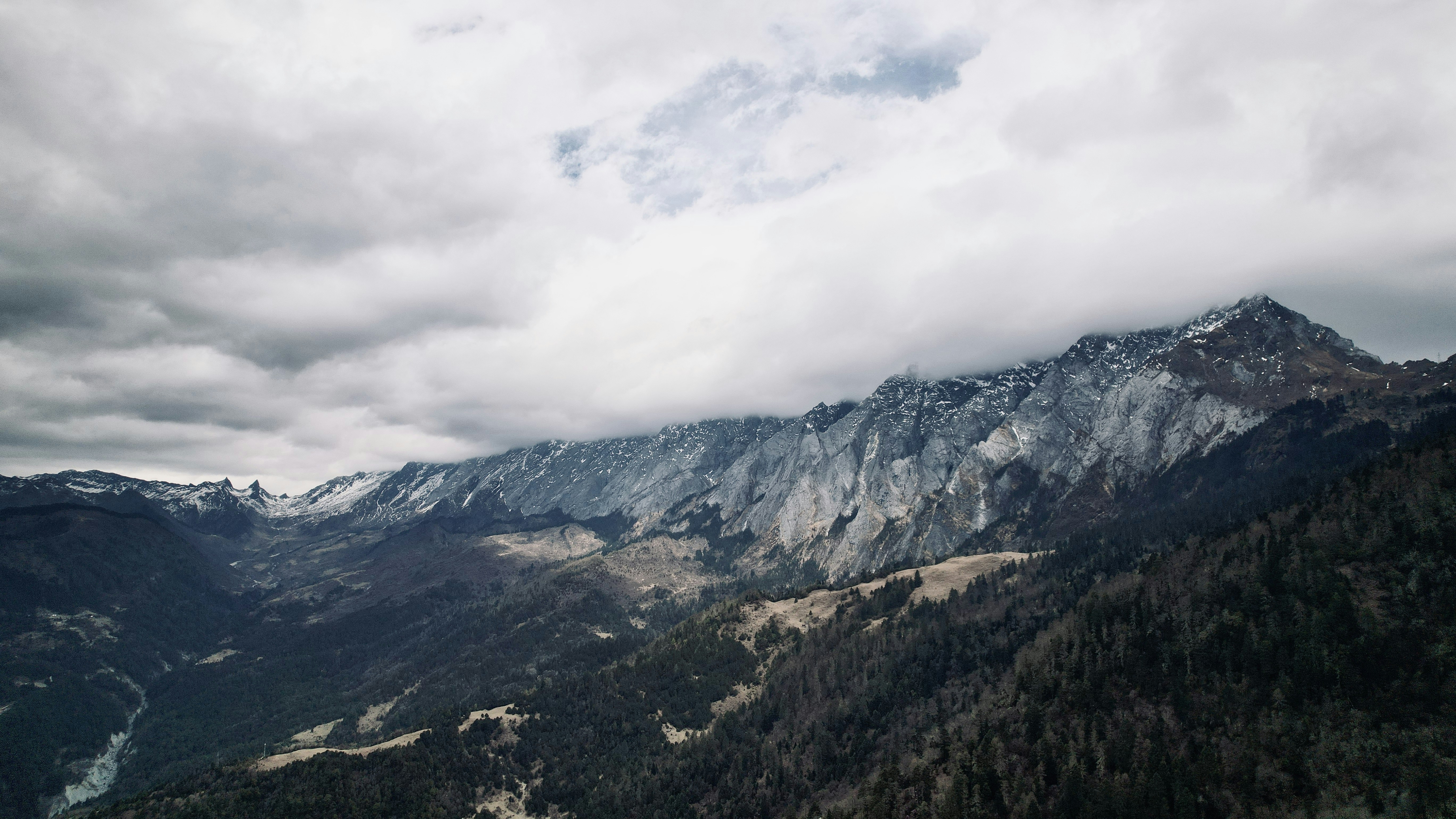 Clouds Over the Craggy Crest: A Cascade of Peaks