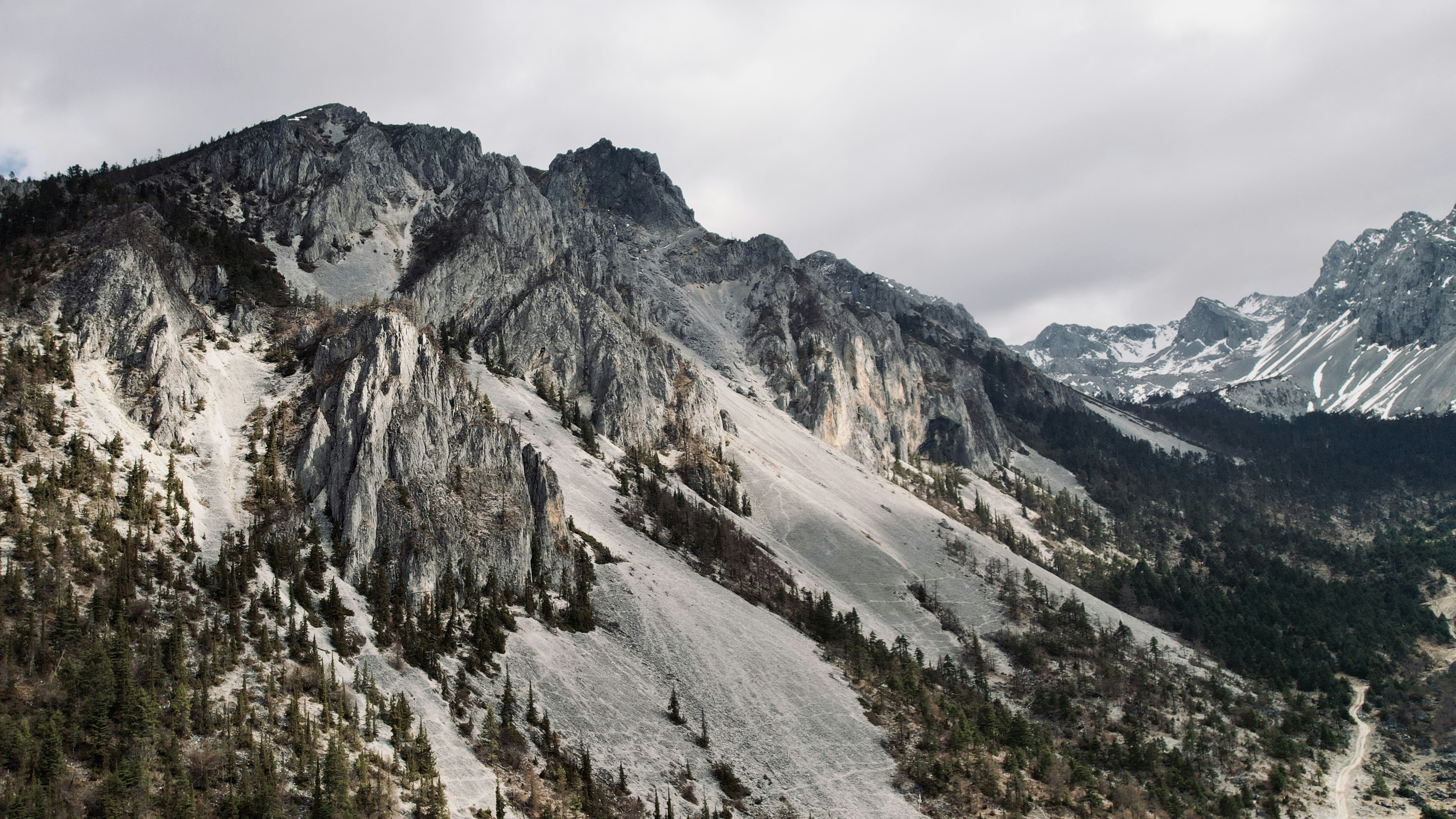 Rugged Peak Valleys under a Grey Loom