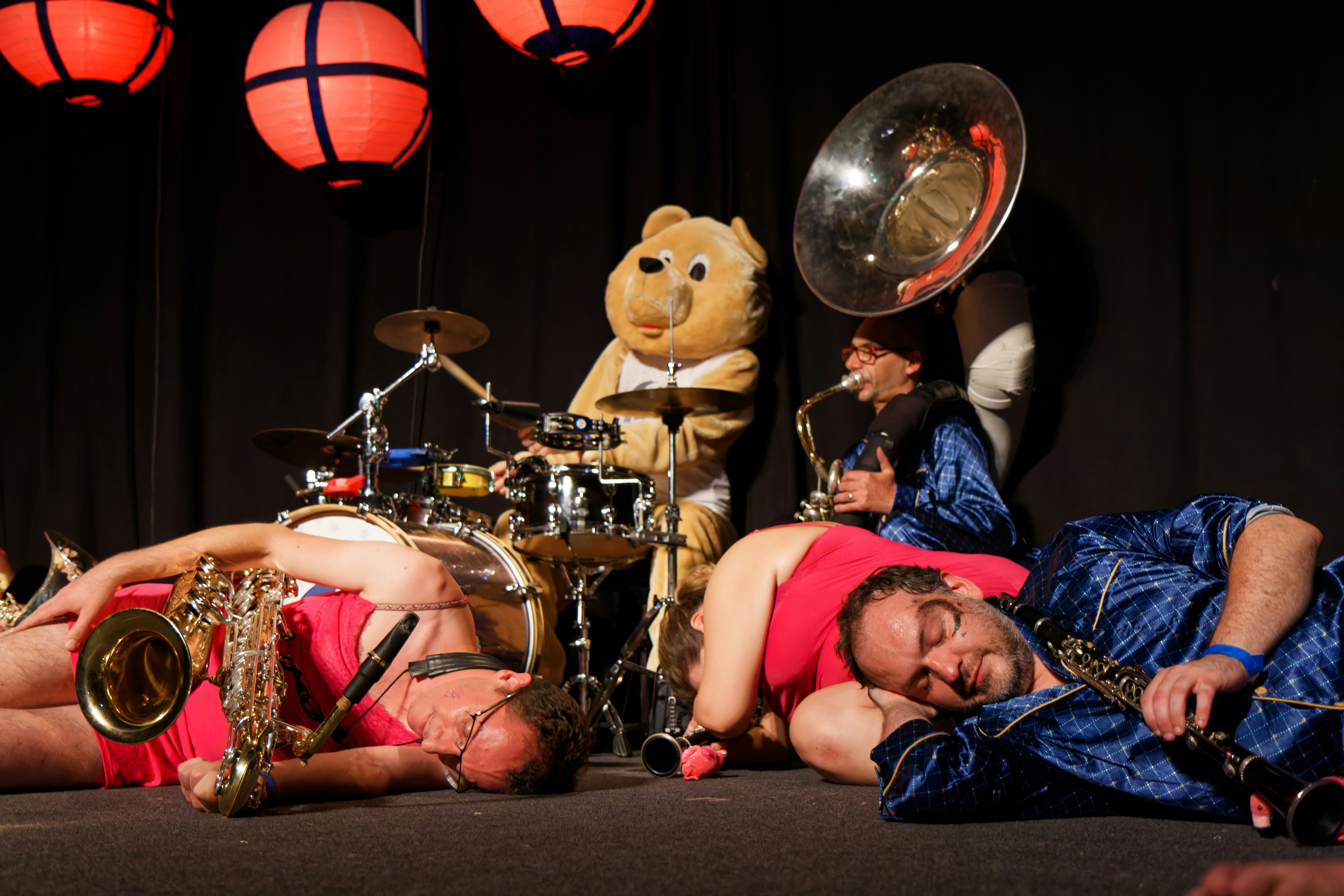 Late-Night Jazz Afterglow: Musicians Rest Amid Stage Props