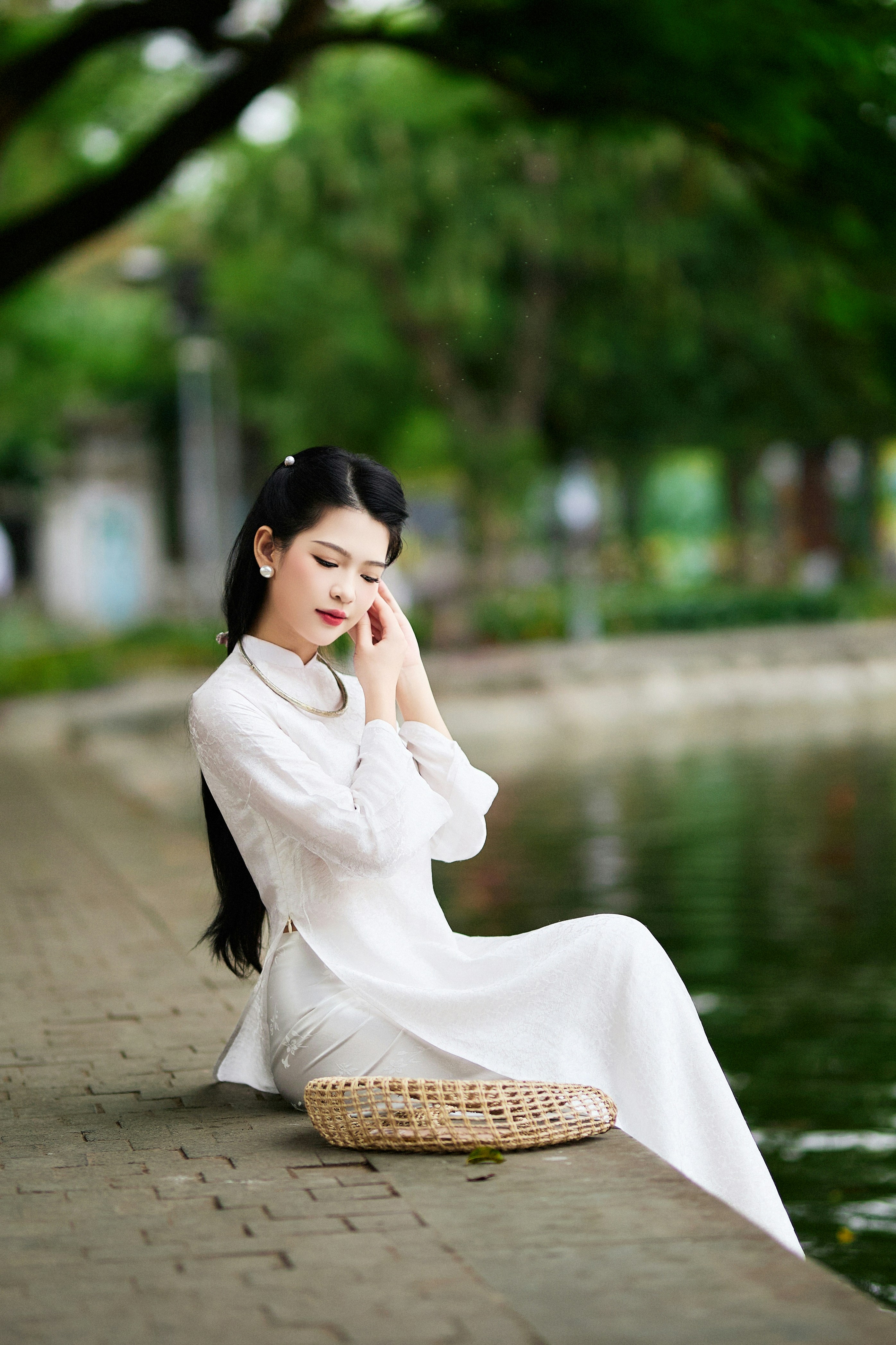 Portrait by the Riverside: Quiet Contemplation in White