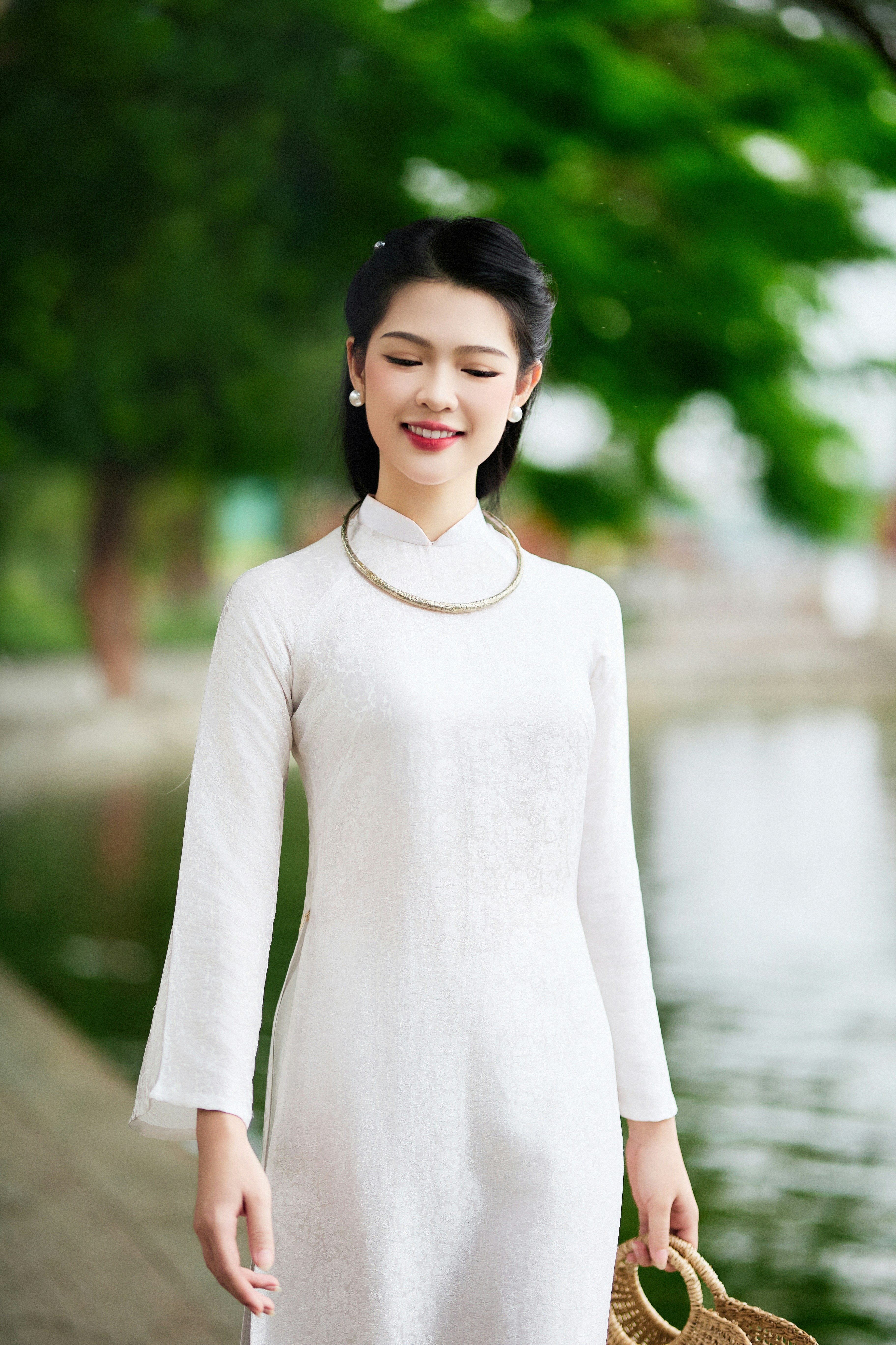 Graceful Poise in White: Portrait by the Pond