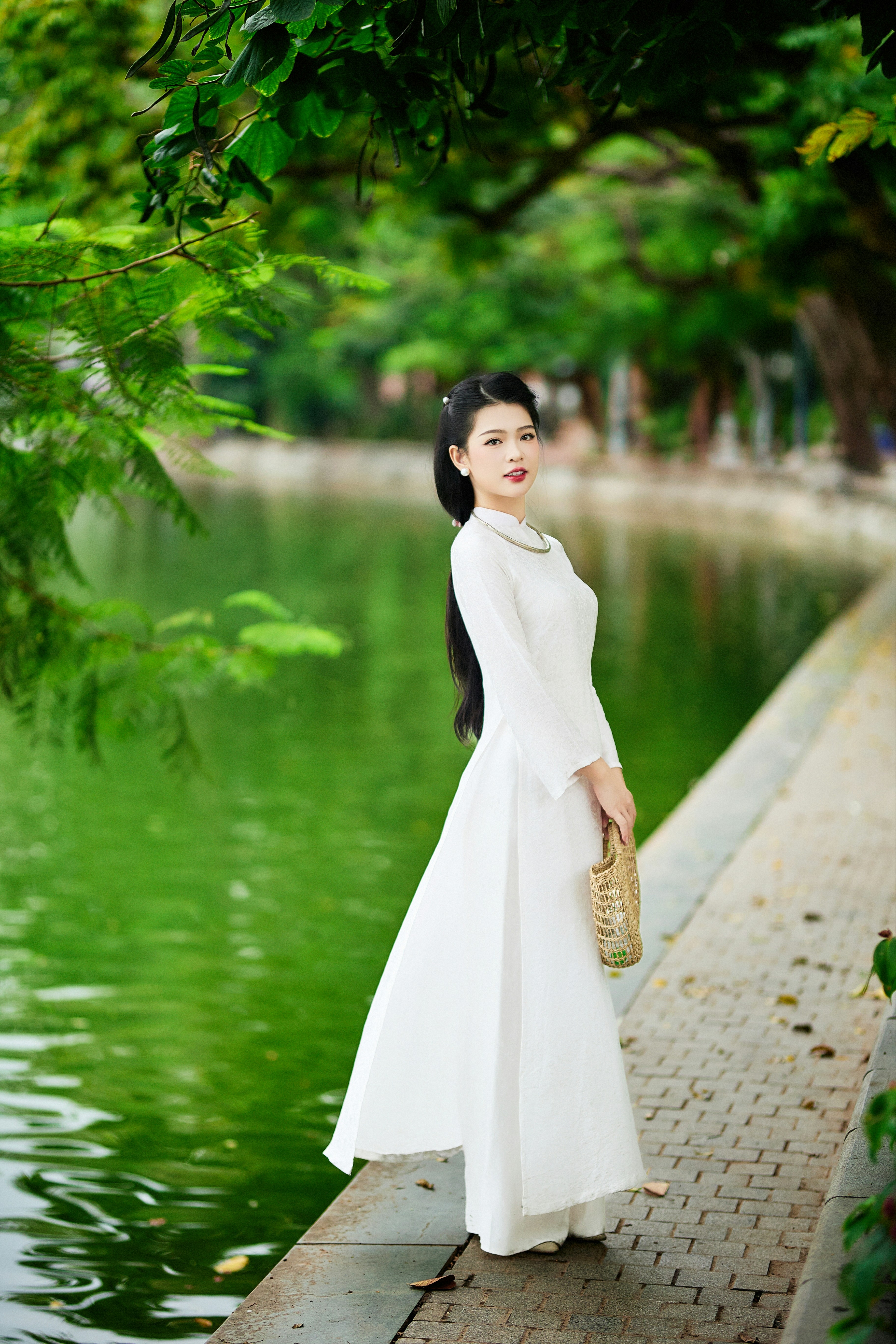 Elegant white dress by the riverside
