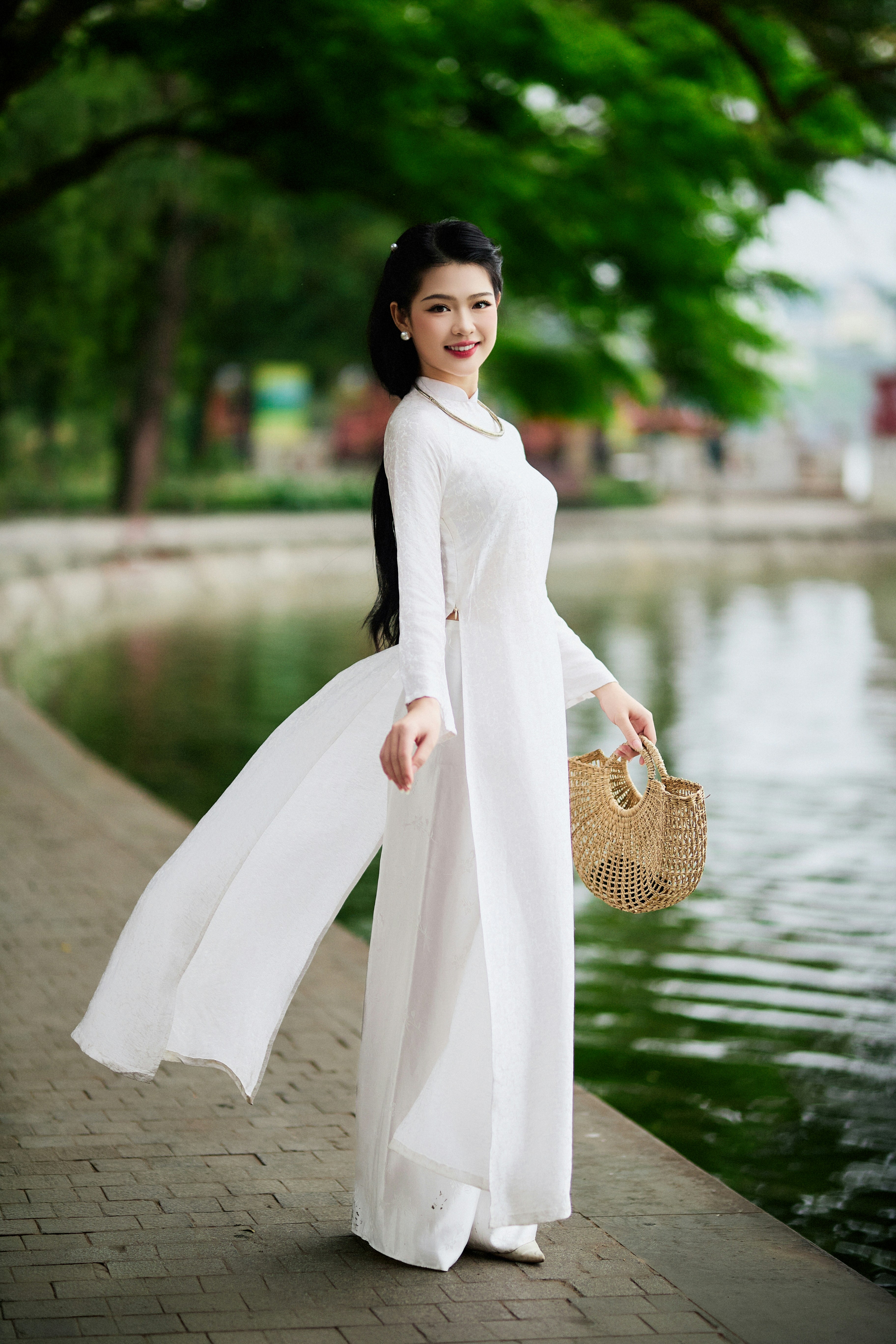 Grace in White by the Riverside Path