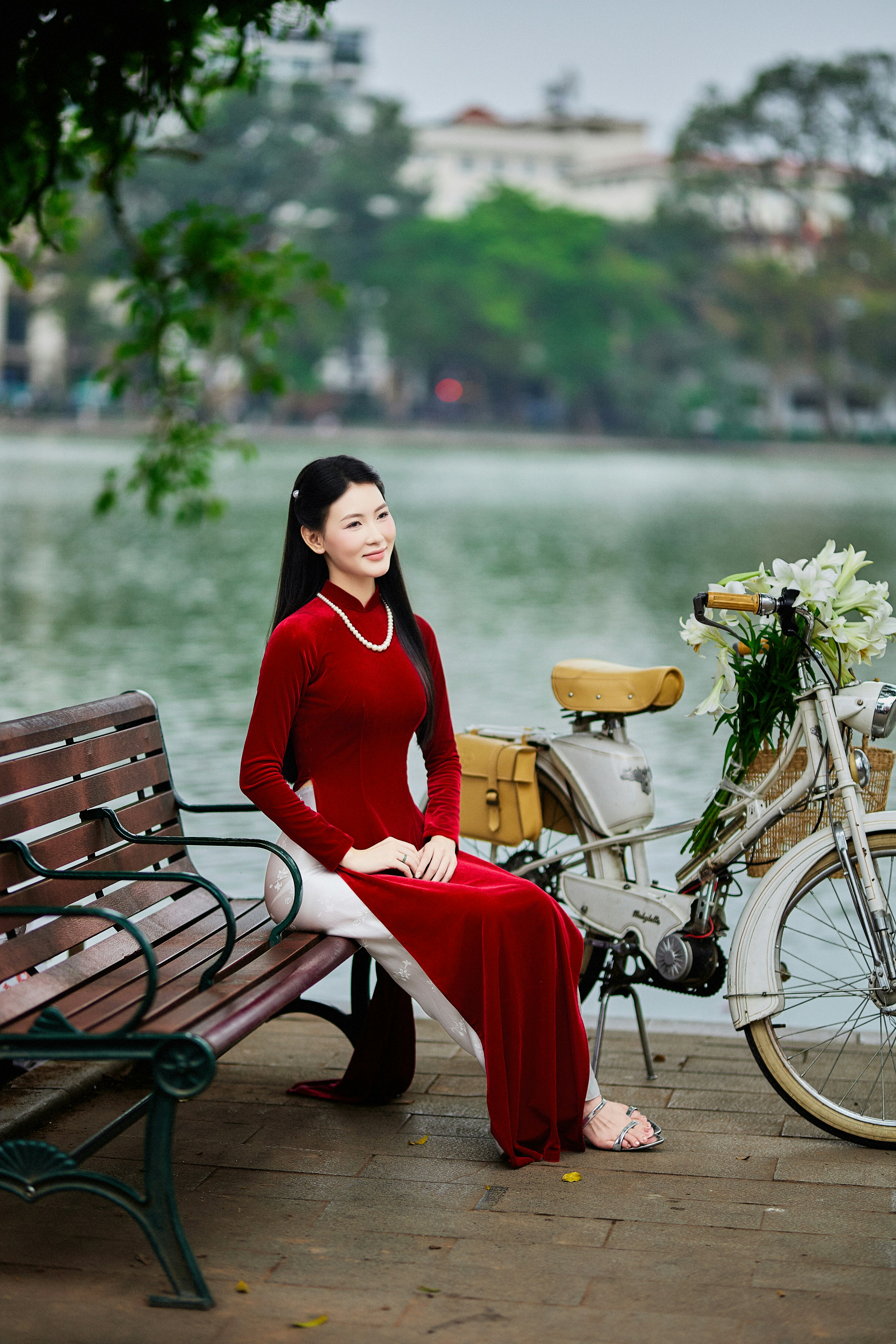 Red Qipao by the Lake: Quiet Confidence on a Riverside Bench