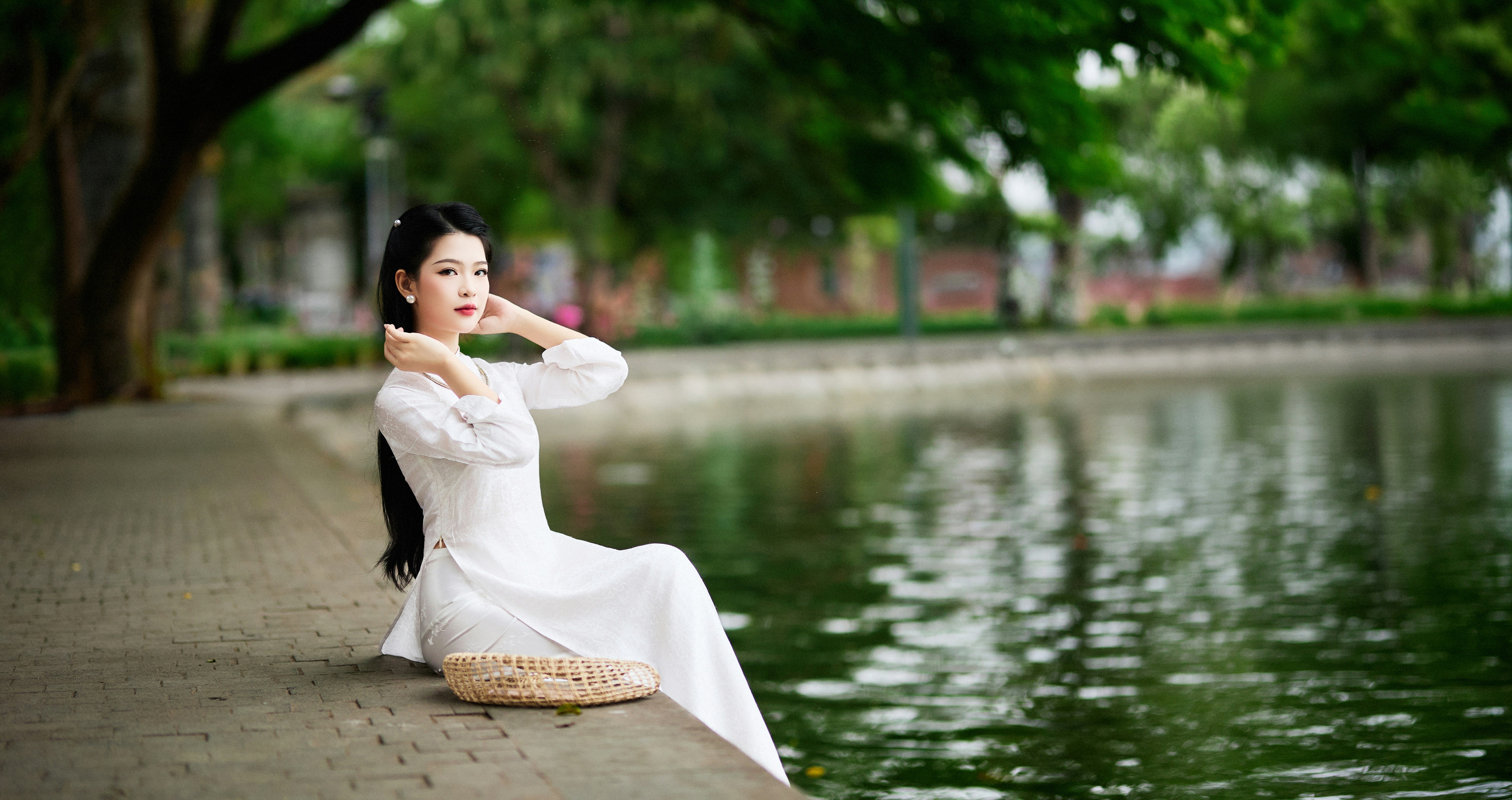 Quiet Poise by the Water: A Portrait in White