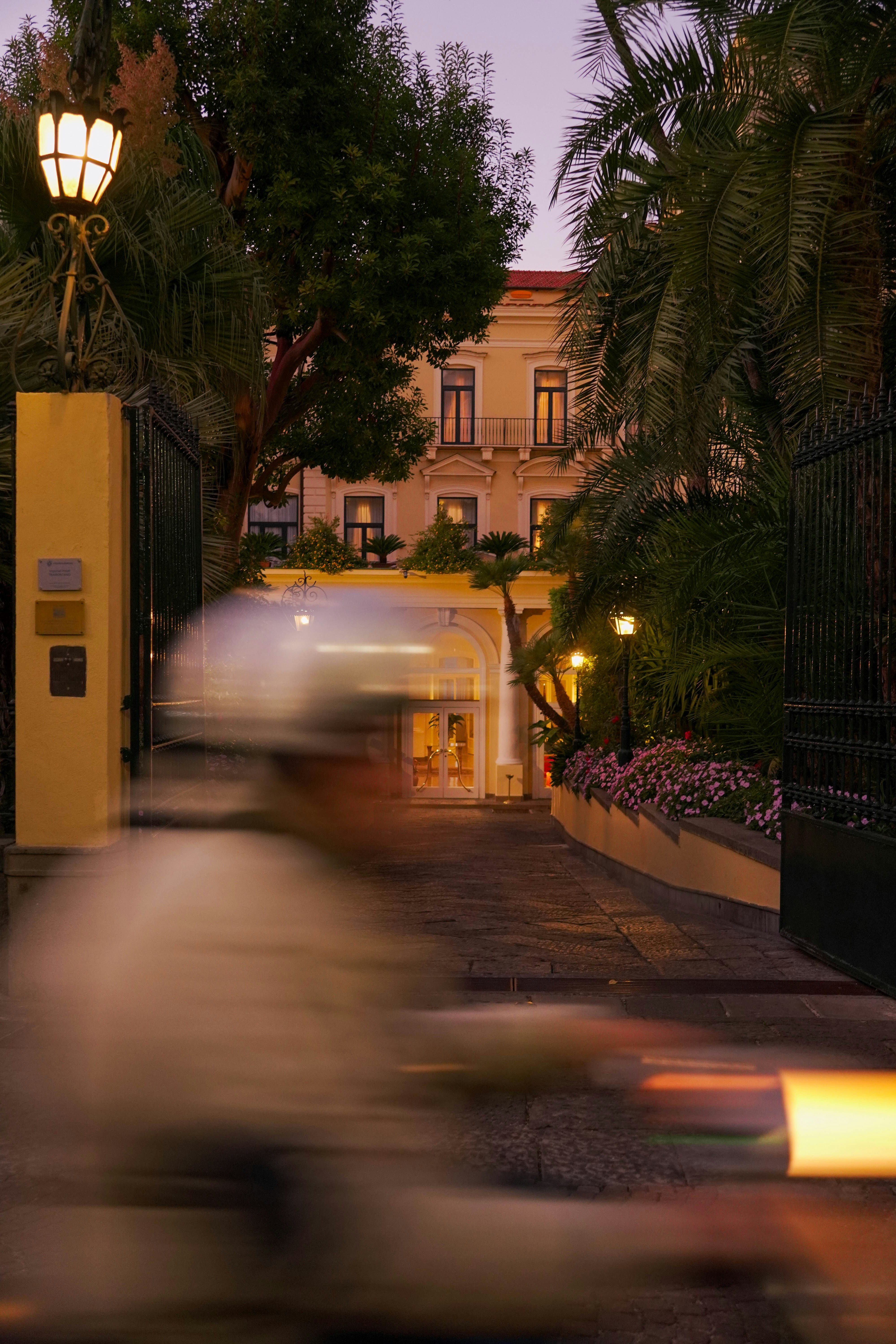 Quiet Courtyard Lane at Dusk with Ghosts of Motion