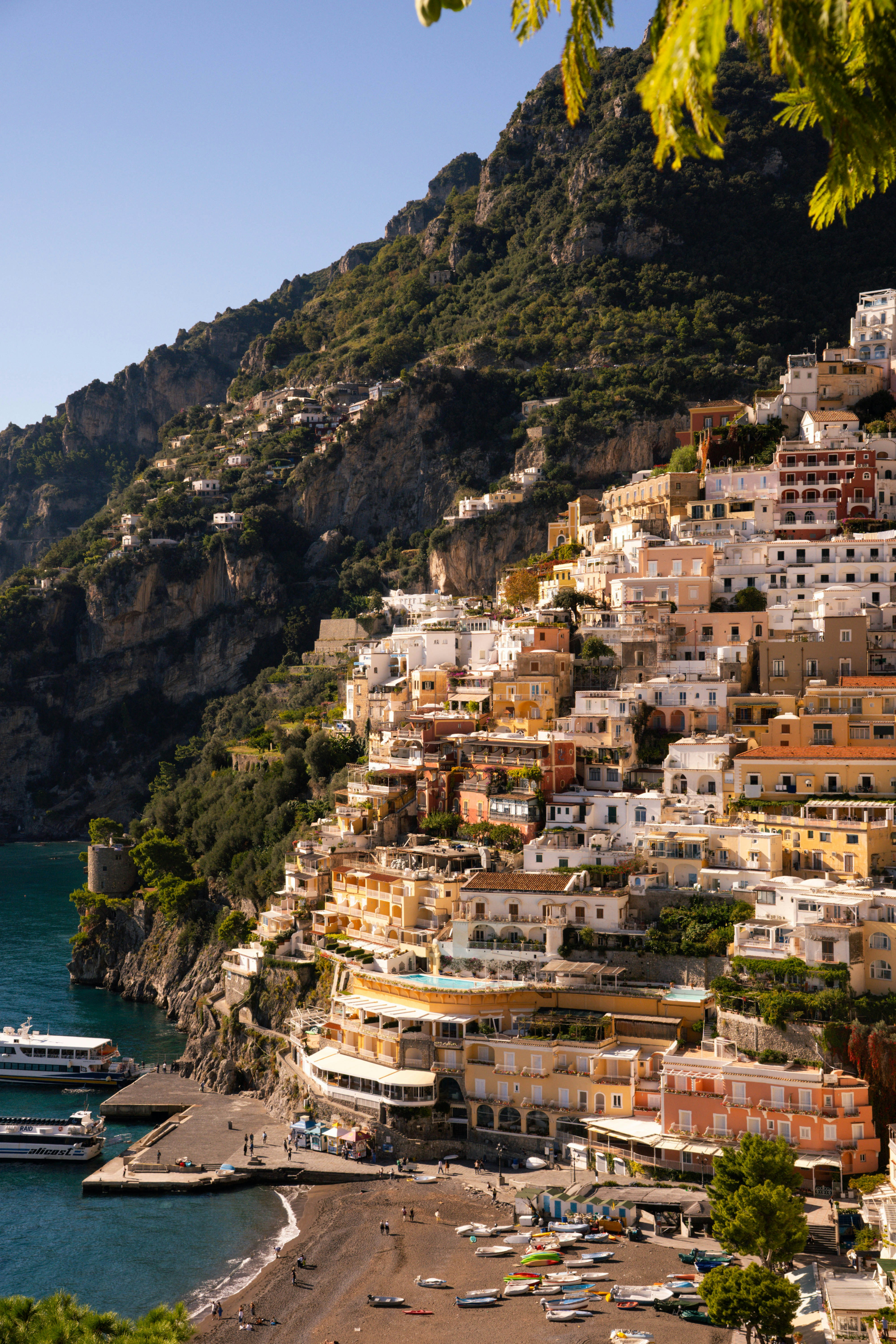 Colorful cliffside village cascading toward the sea