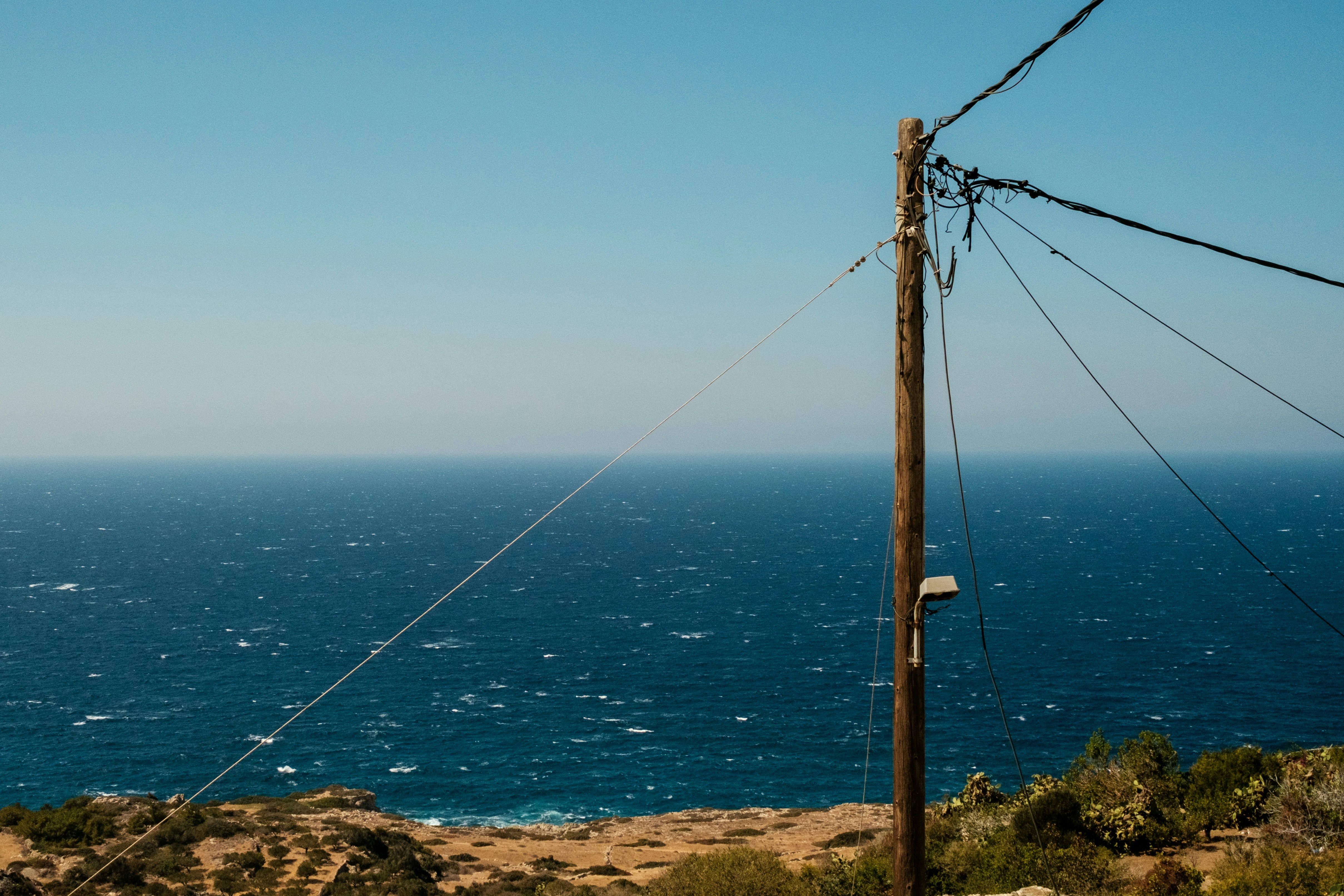 Coastal Horizon with a Weathered Utility Line