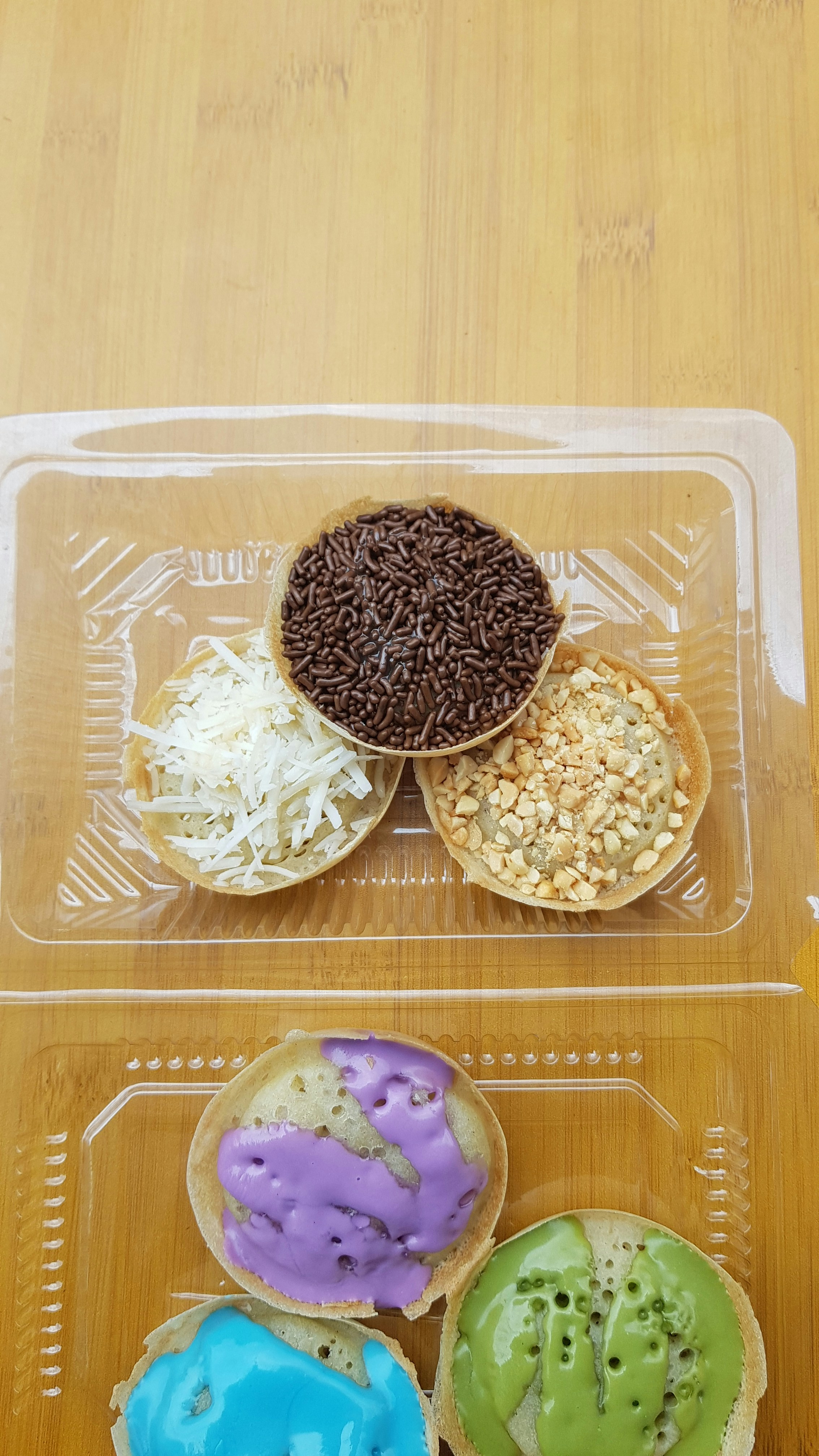 Assorted Frosted Pastry Trio Resting in Clear Plastic Tray