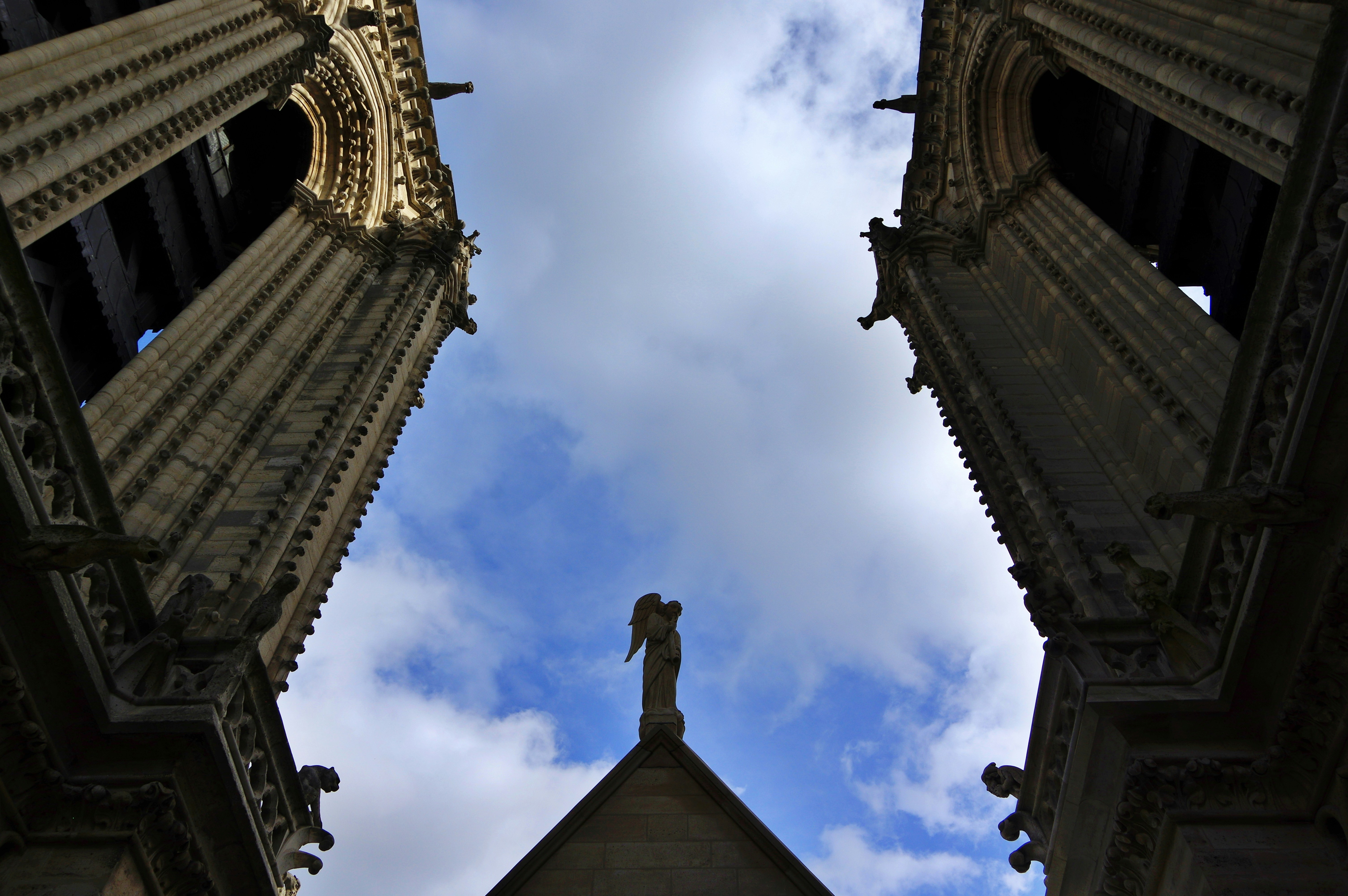 Towered Negatives: A Skyward View Between Gothic Spires