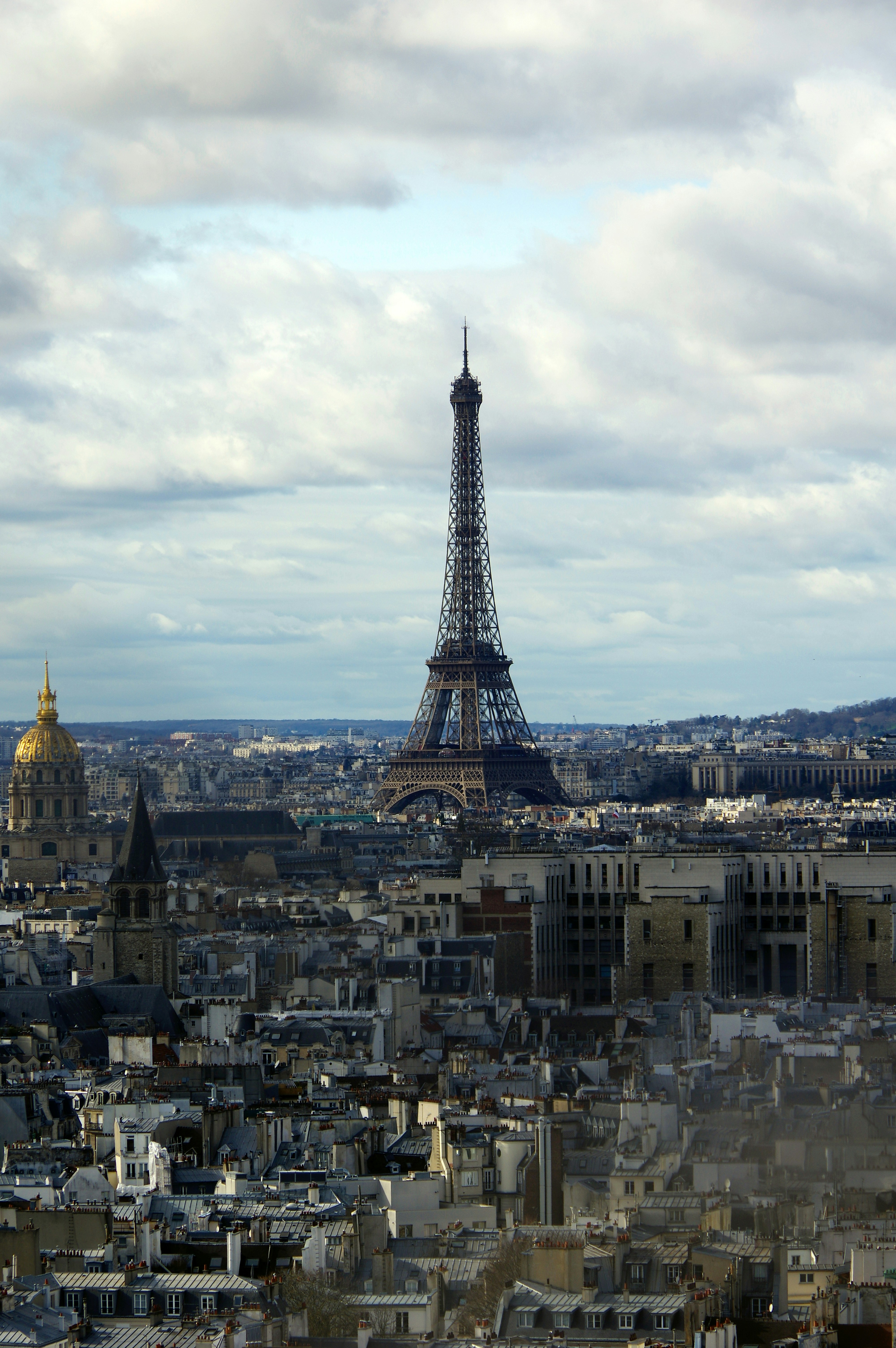 Eiffel Tower Framed Above the Paris Rooftops at Dusk
