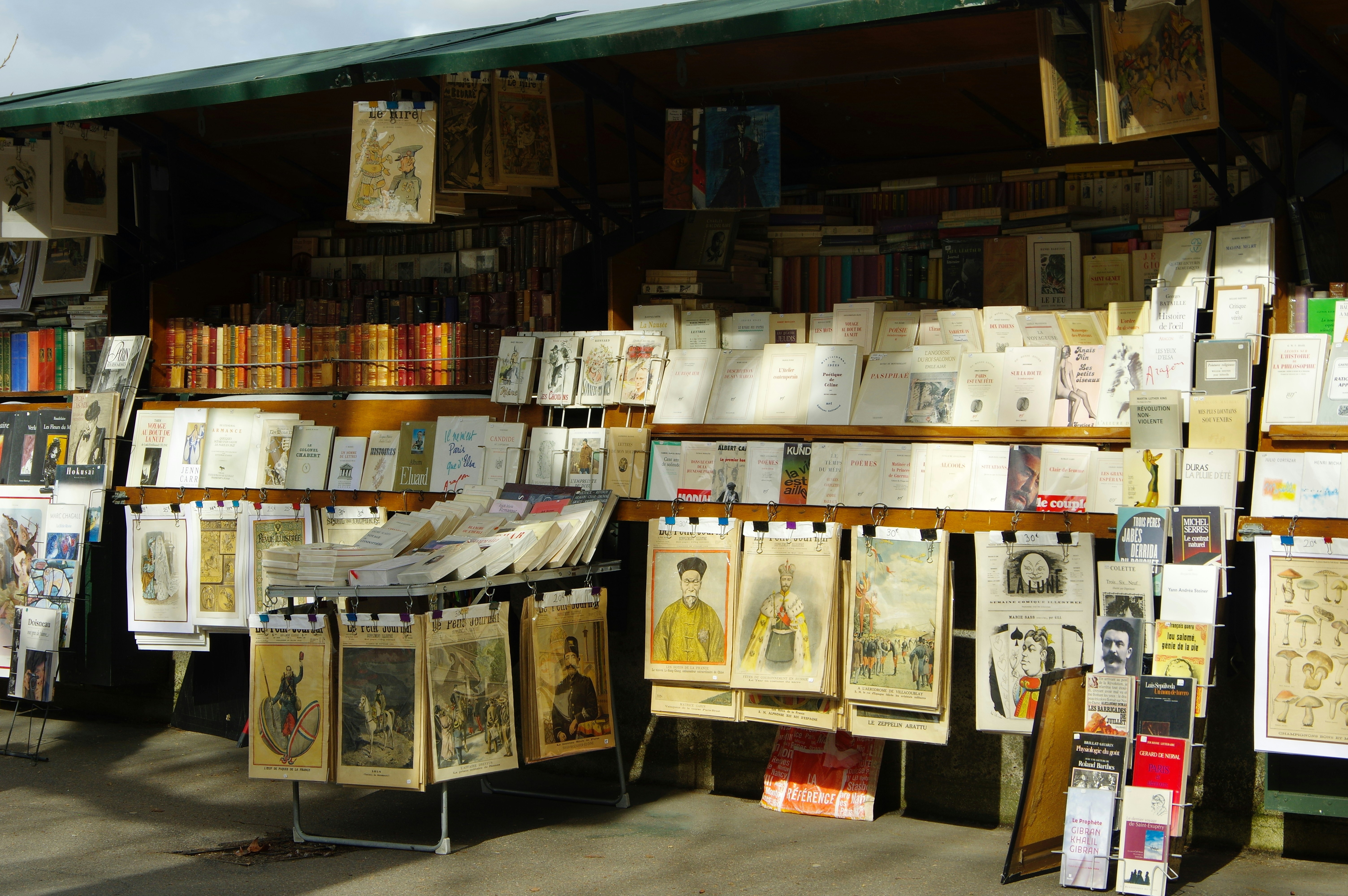 Books on Display: A Stacked Street Stall of Prints and Pages