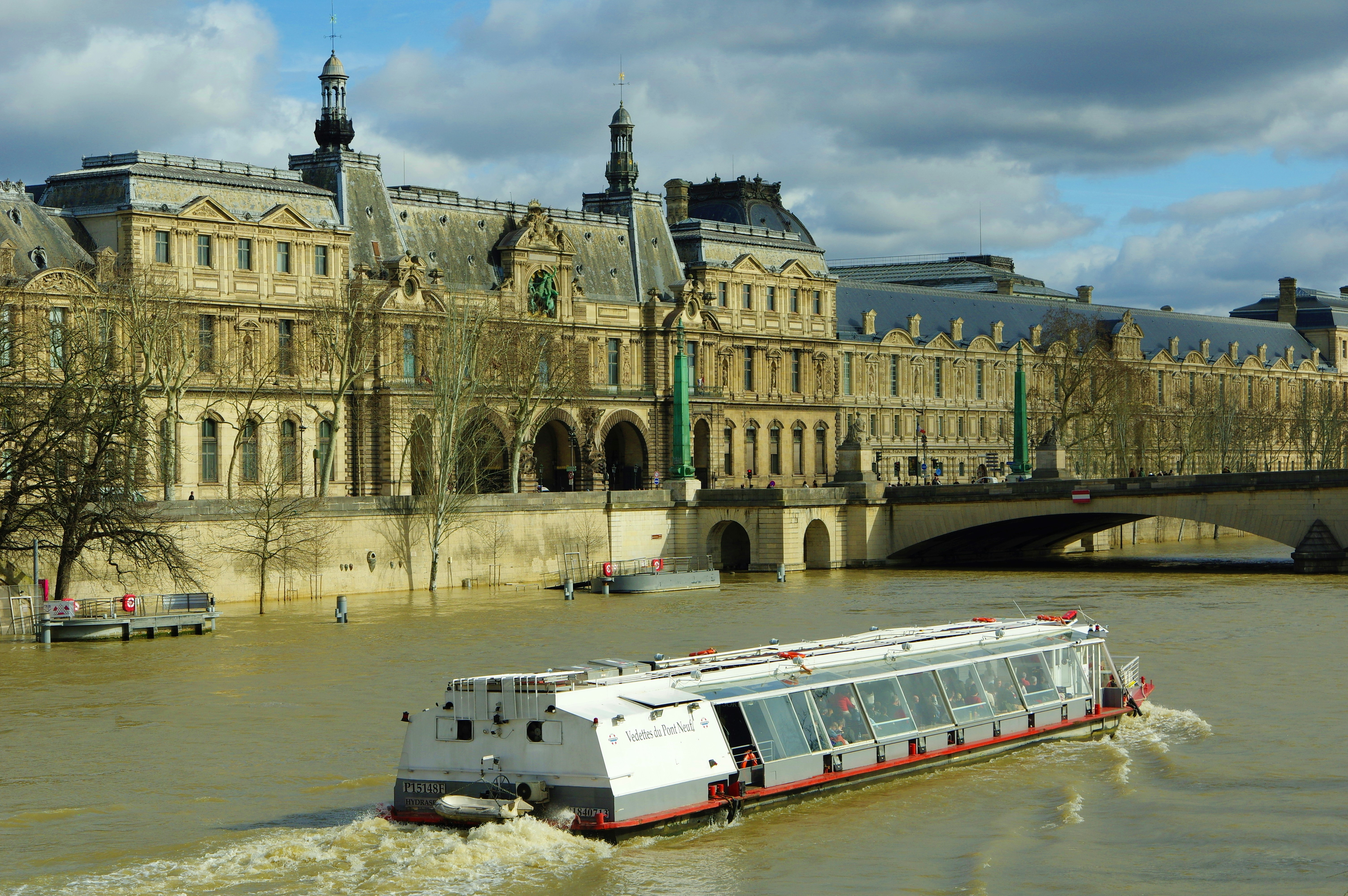 Mighty river tram gliding past classical façades